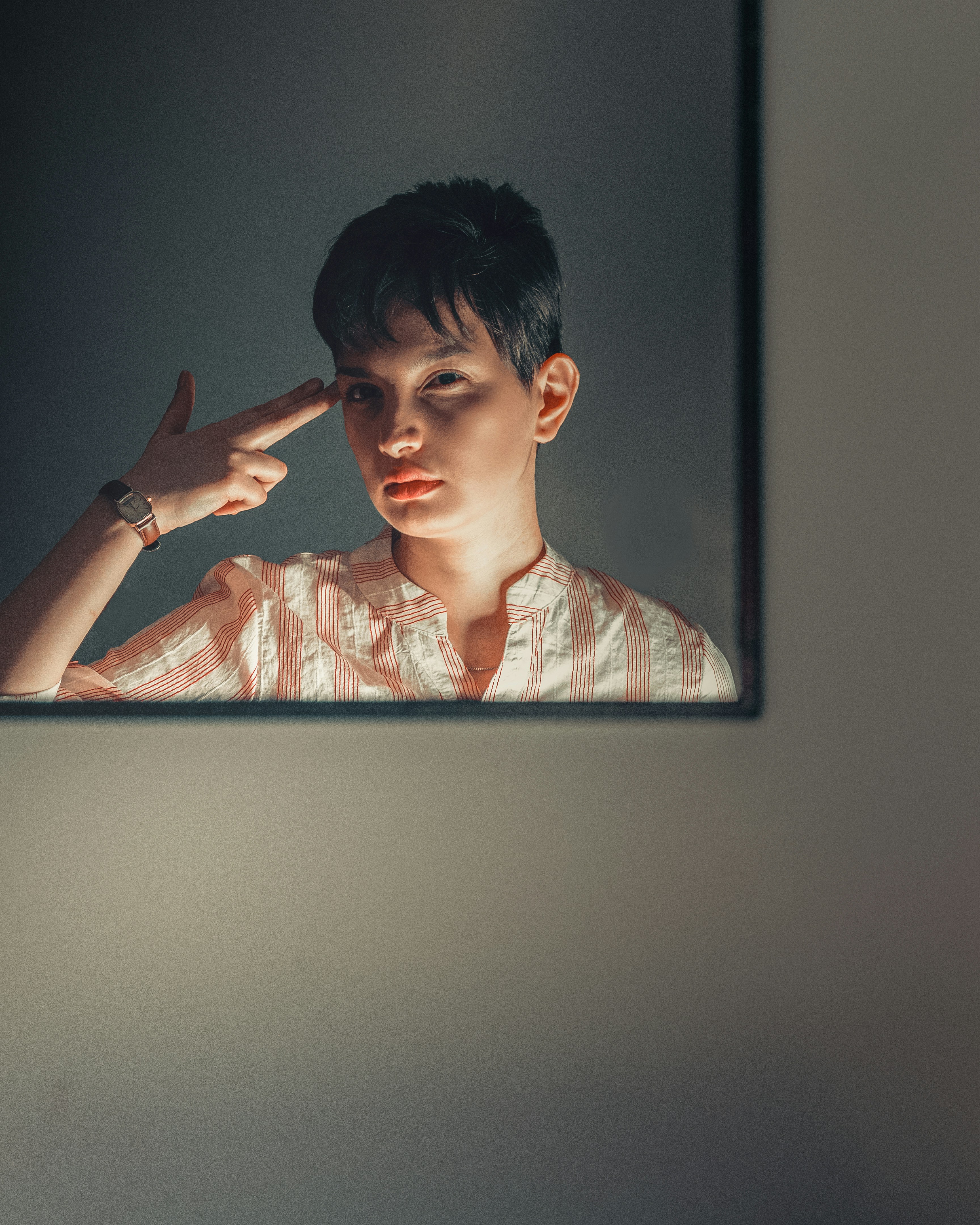 Quiet Gaze in a Backlit Mirror