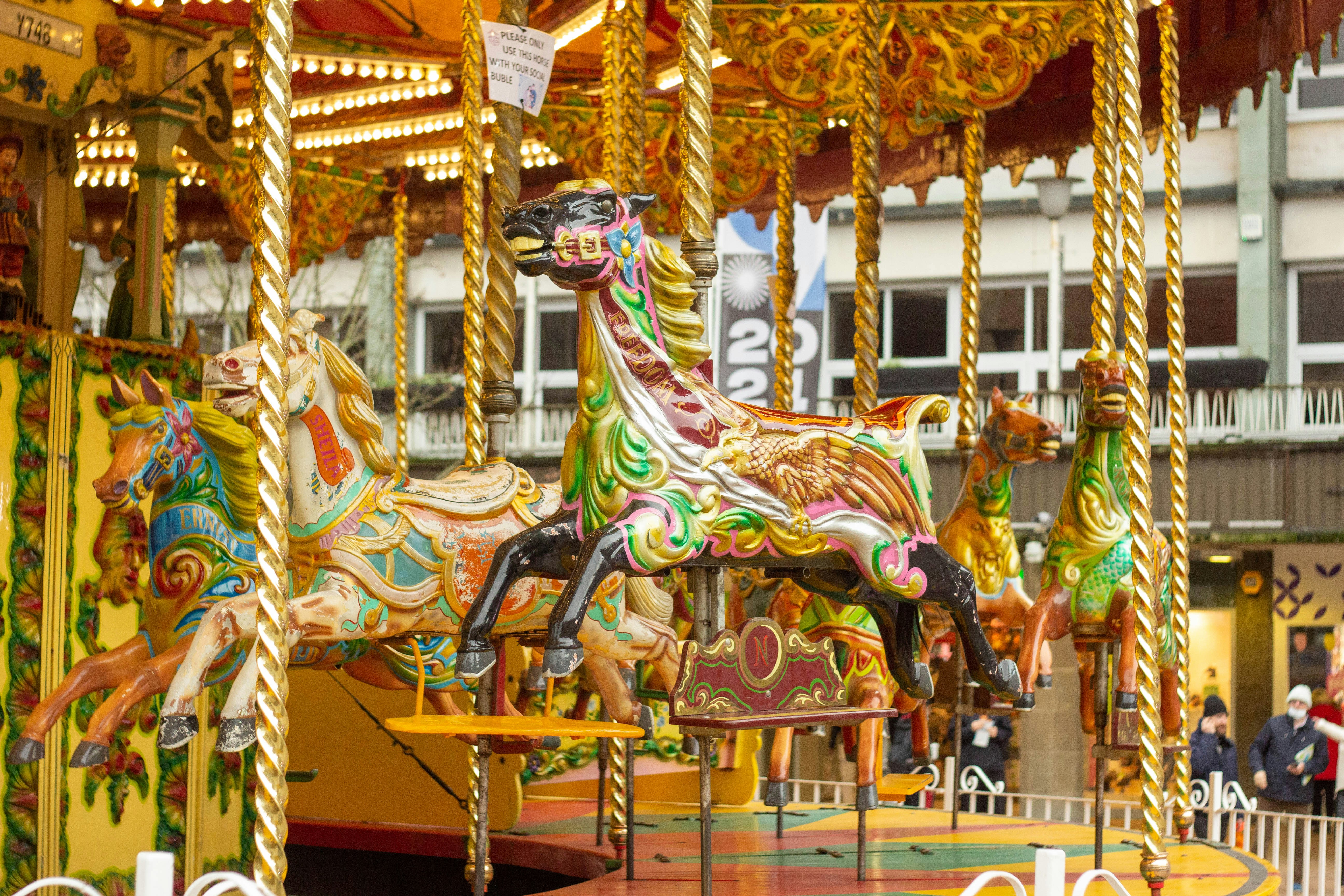 Brown and green carousel with lights photo – Free Person Image on Unsplash