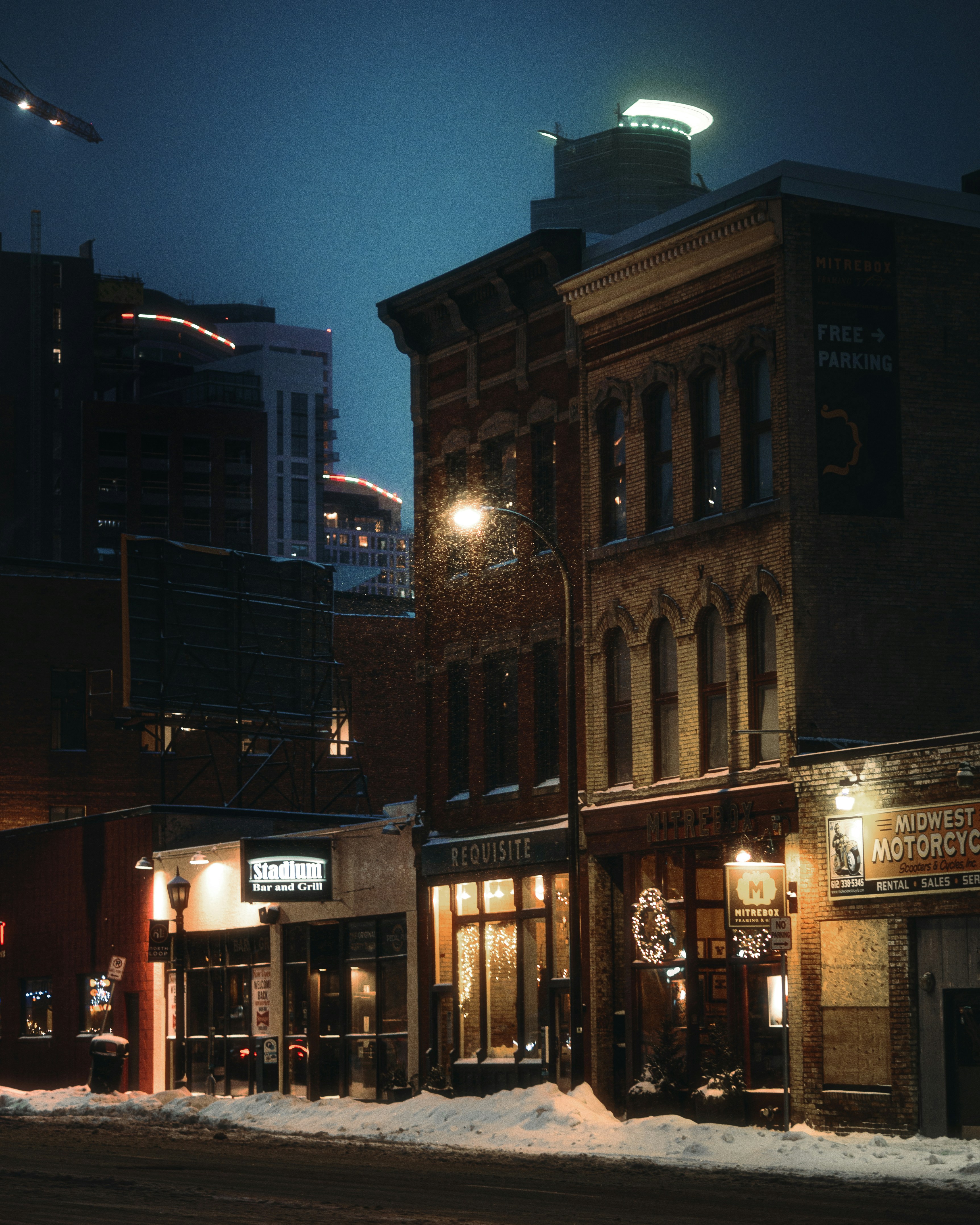 Snow-kissed Main Street Beneath Nightfall Neon