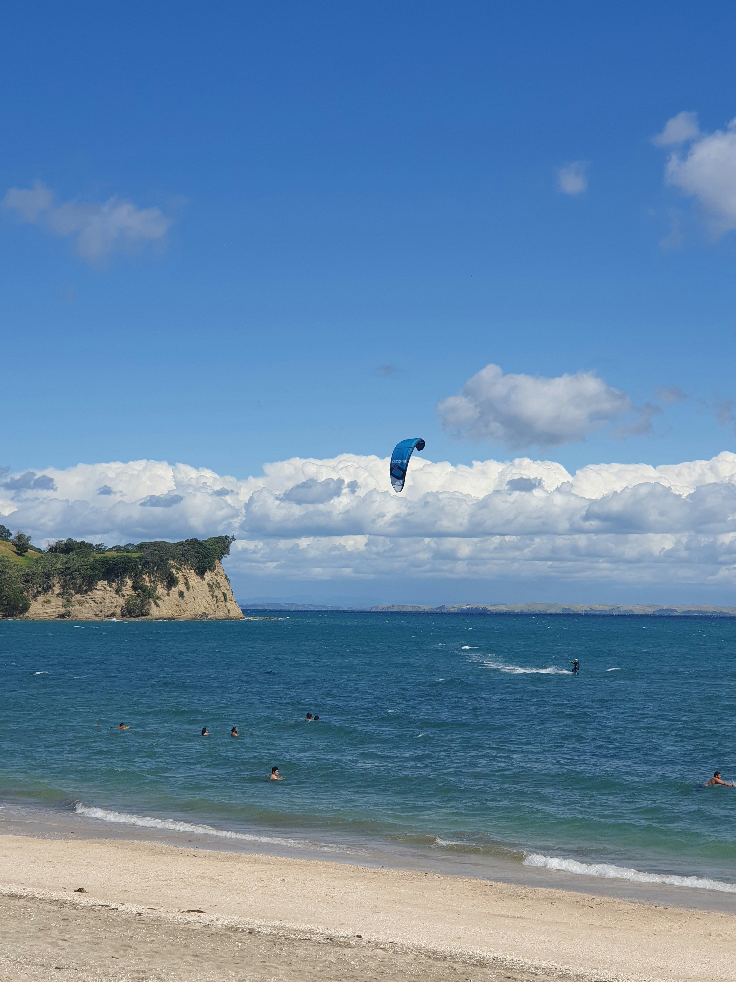 Person in blue jacket and blue denim jeans jumping on sea during ...