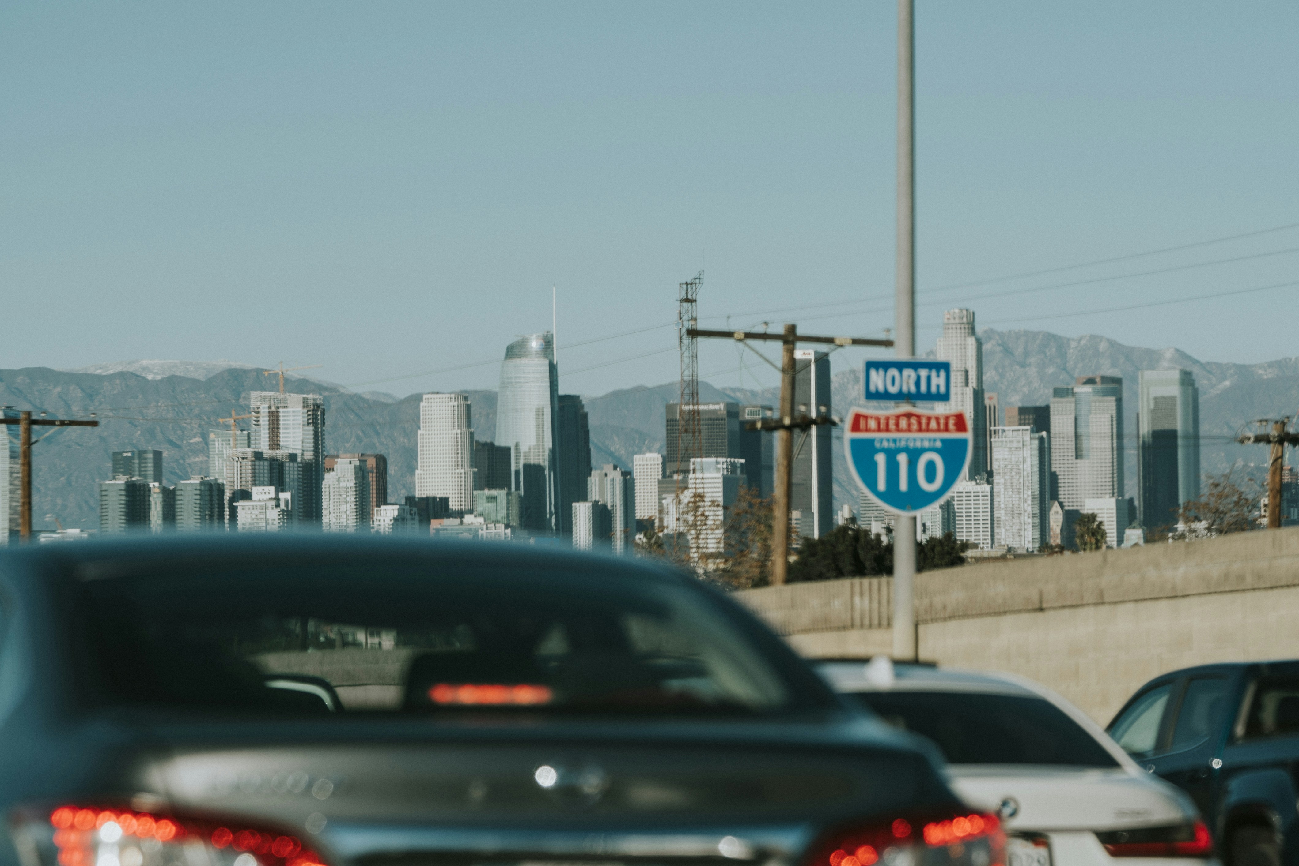 Cityscape in Motion: Freeway Fragments Against a Distant Skyline