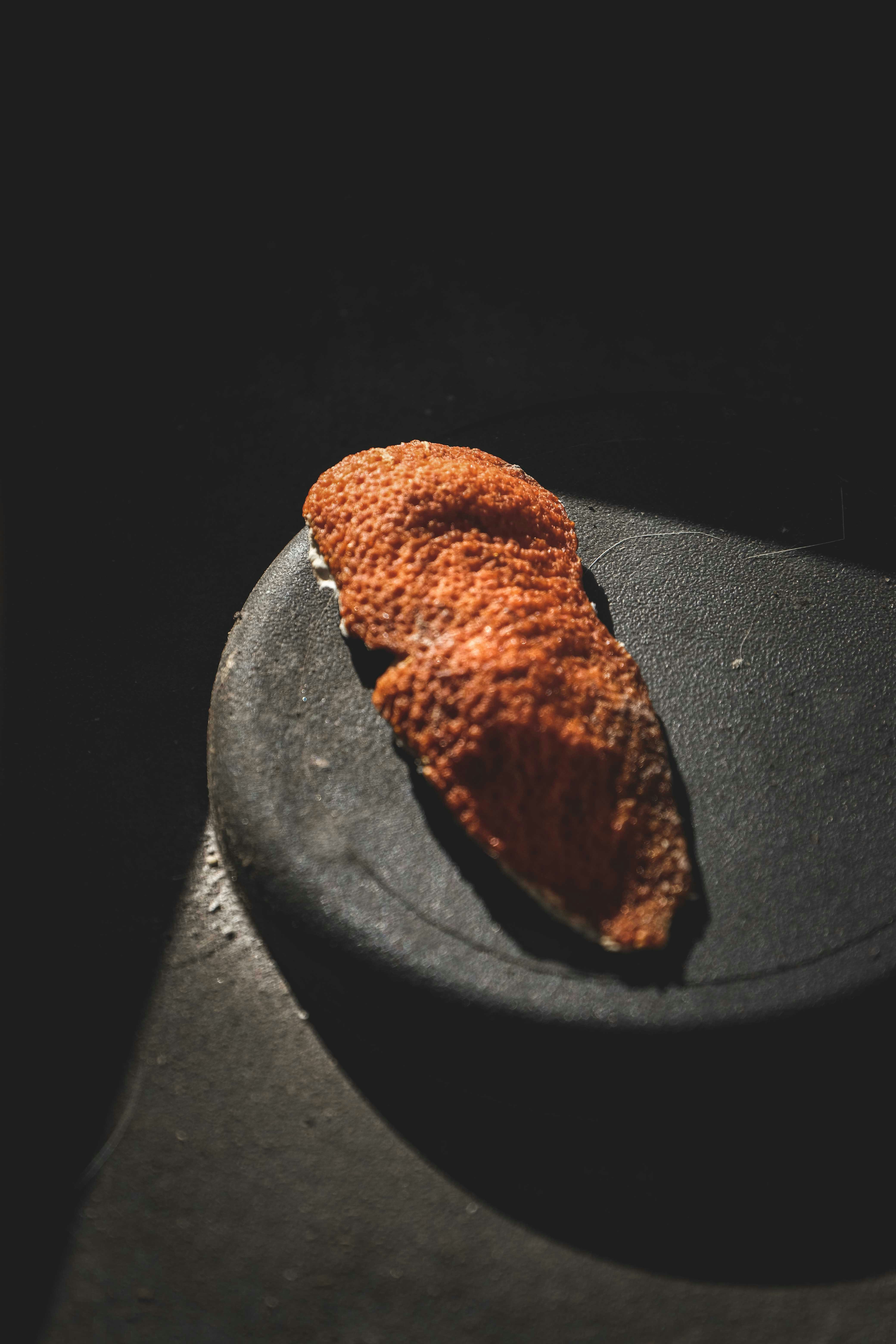 brown bread on black round plate