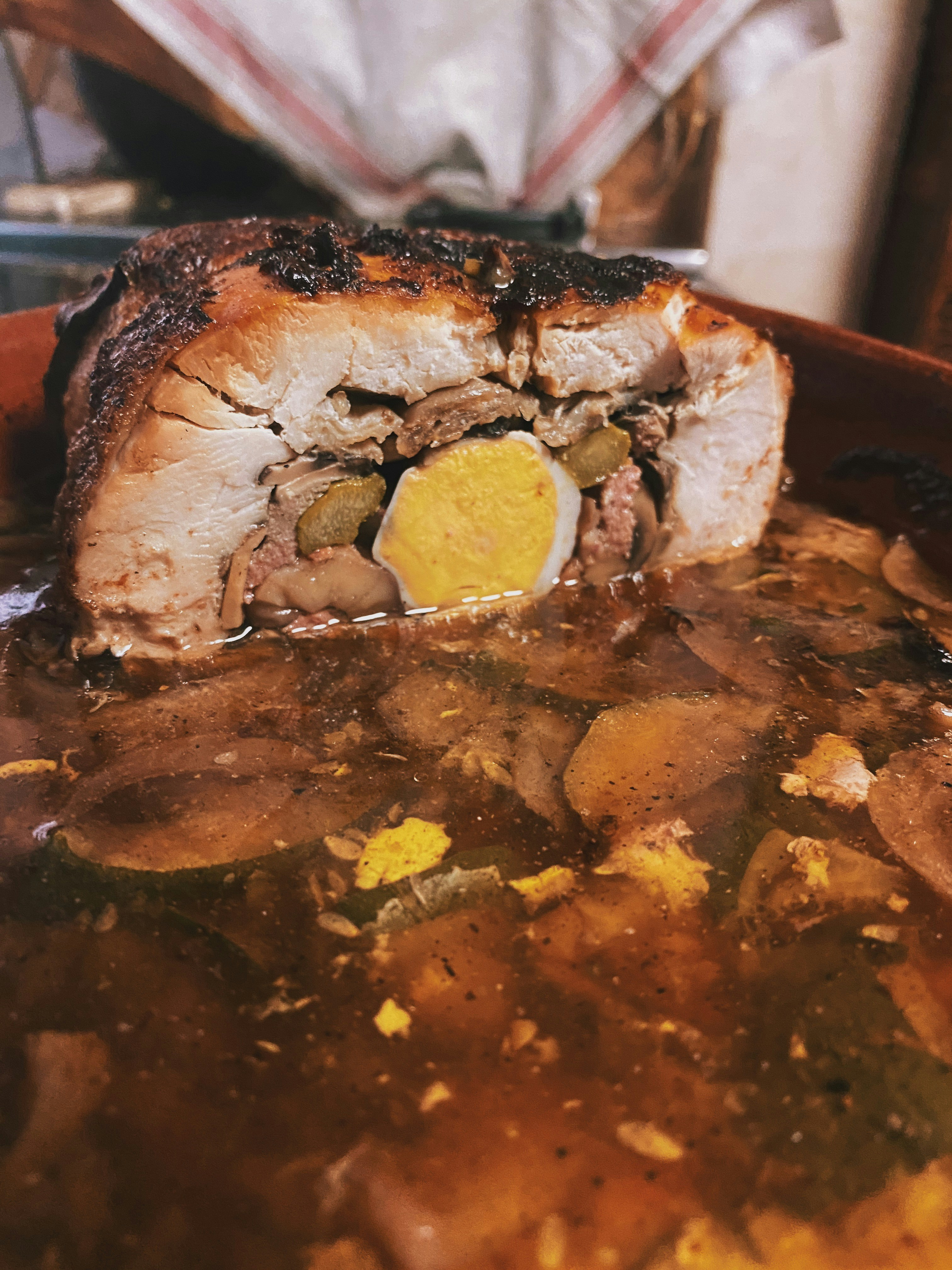 Inside-Out Roast: A Slice That Reveals Egg and Savory Pan Gravy