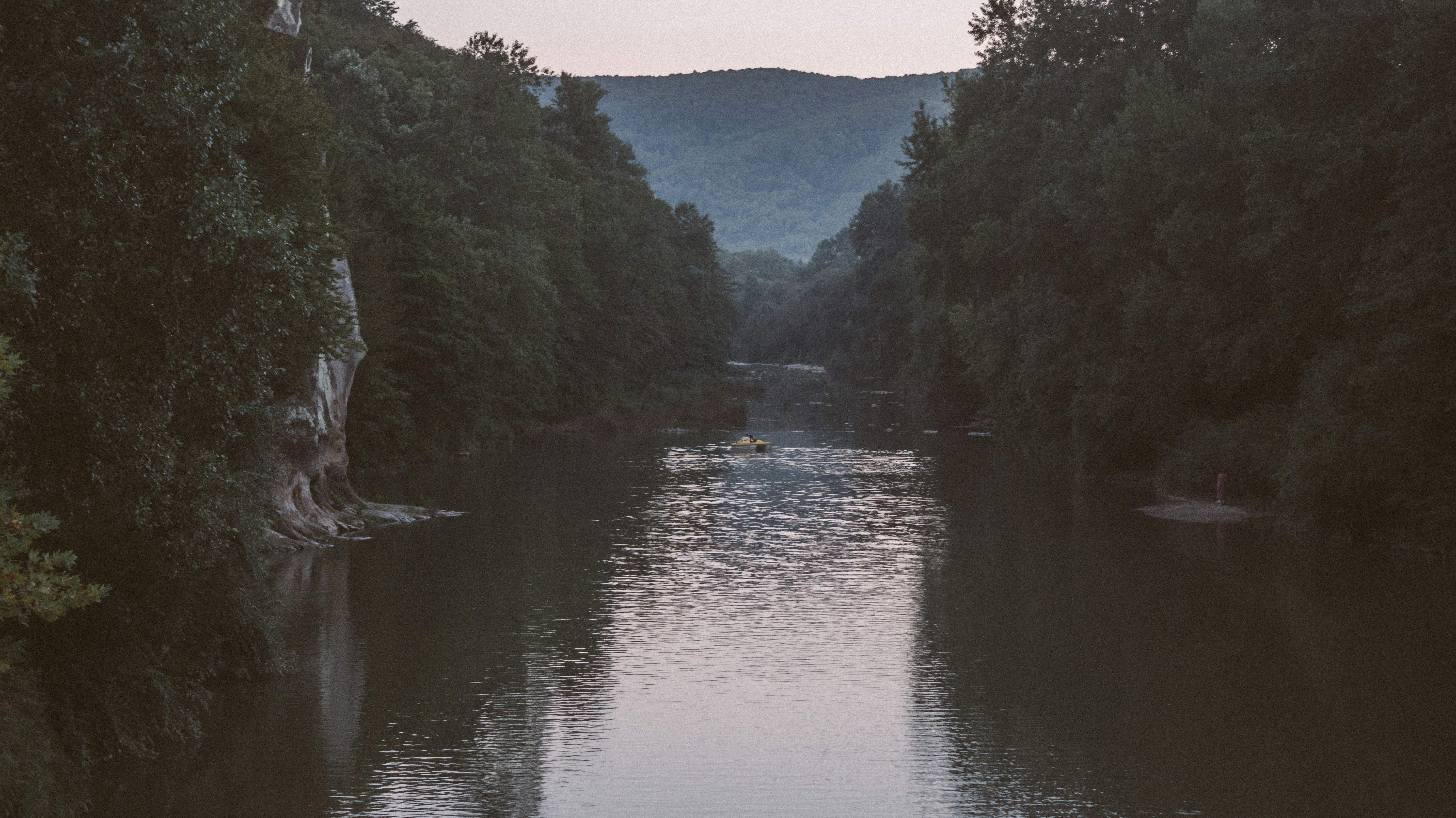 Dusk on the Serene Gorge River: Light Fades Between Pines