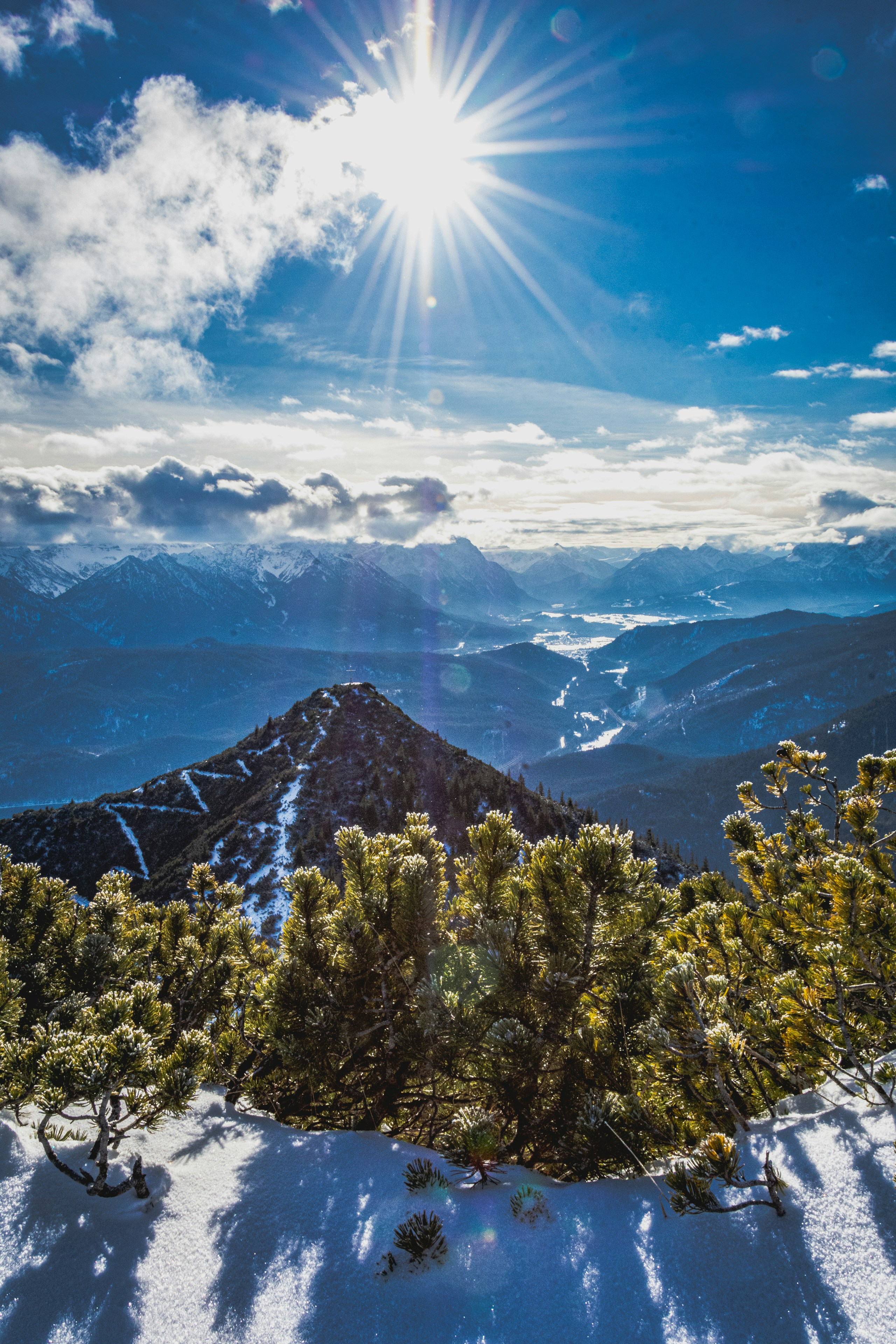 Sunburst Over Snowbound Pines: A Crystalline Alpine Panorama