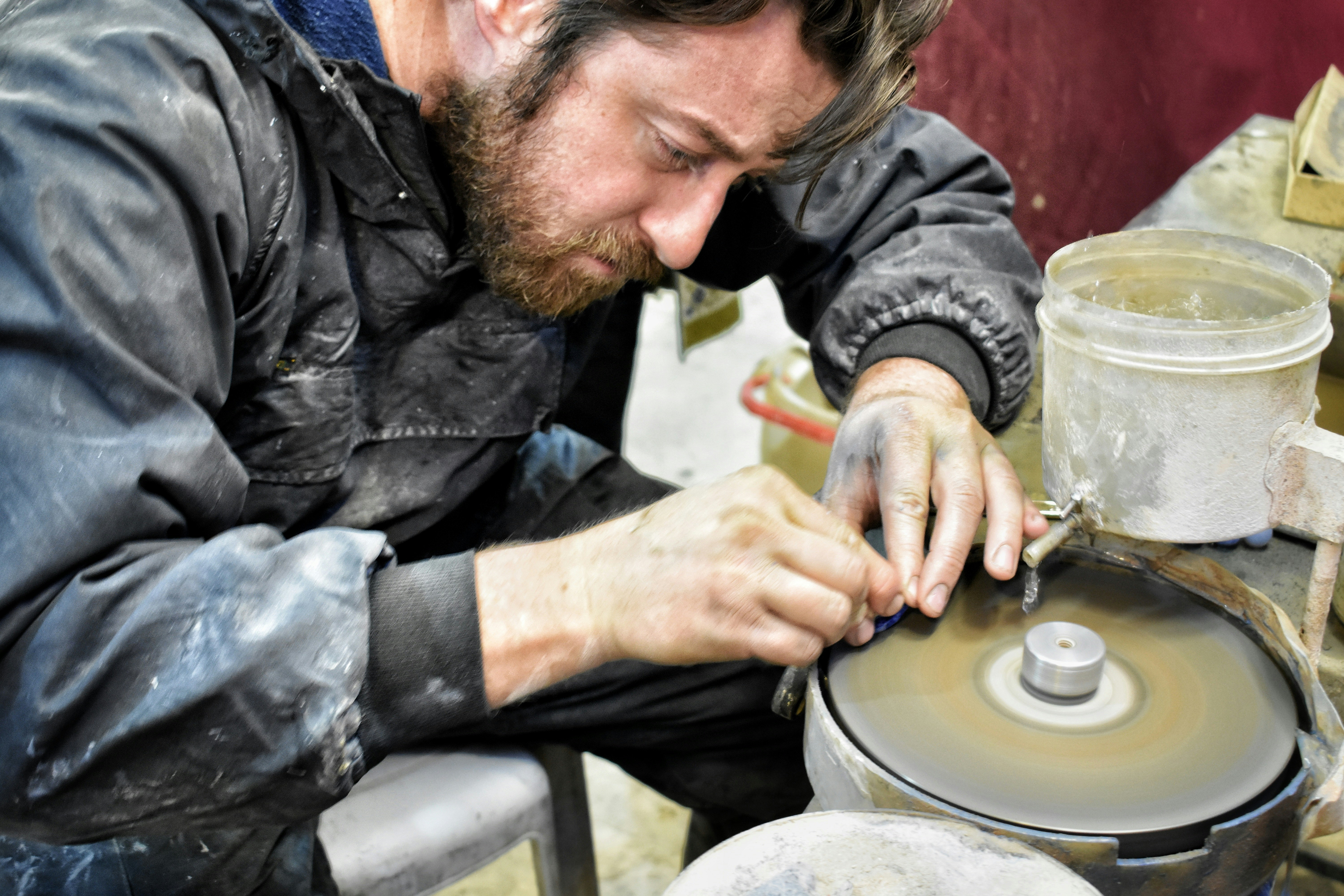 Handcraft in Motion: A craftsman shaping a potter's wheel