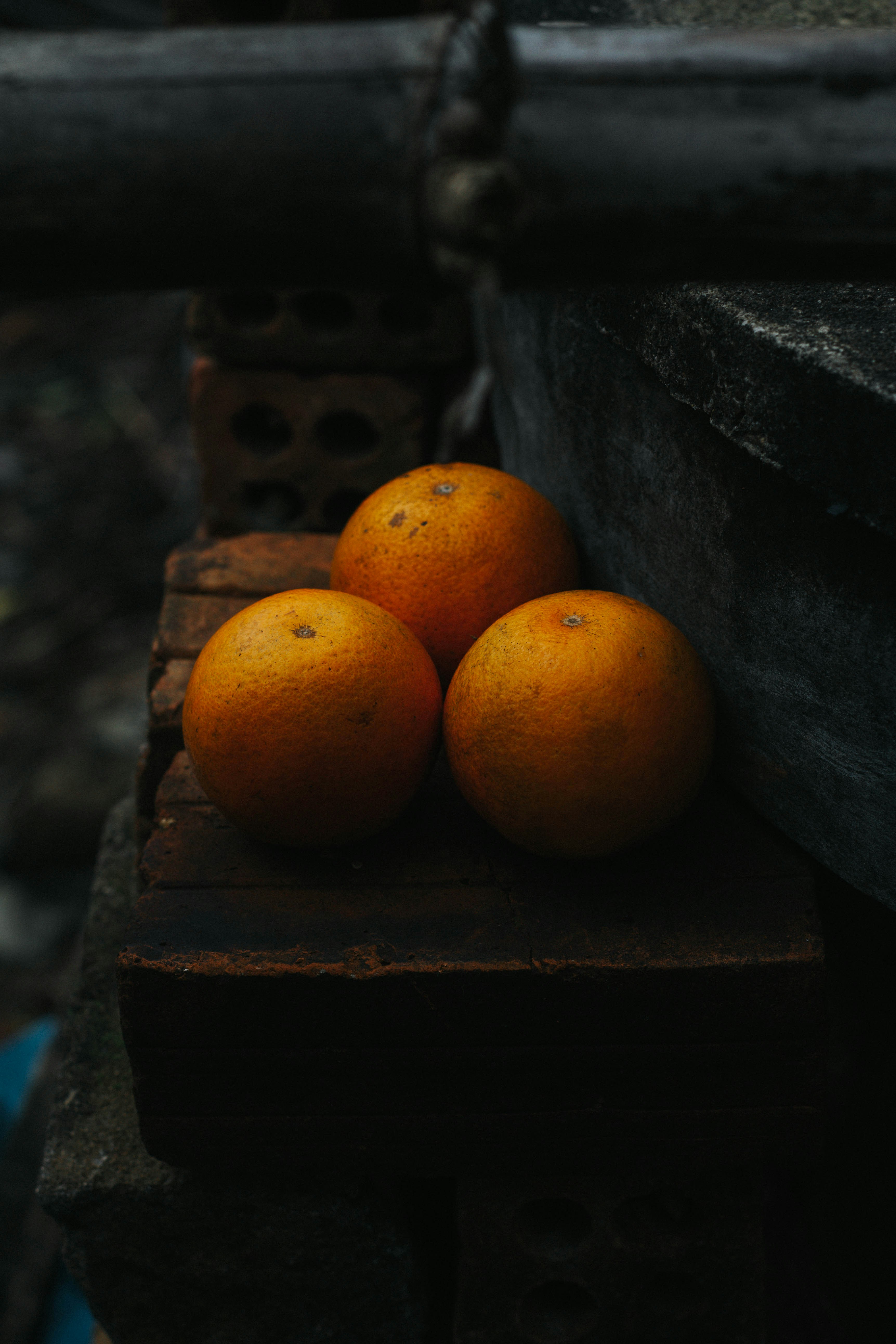 orange fruit on brown wooden table