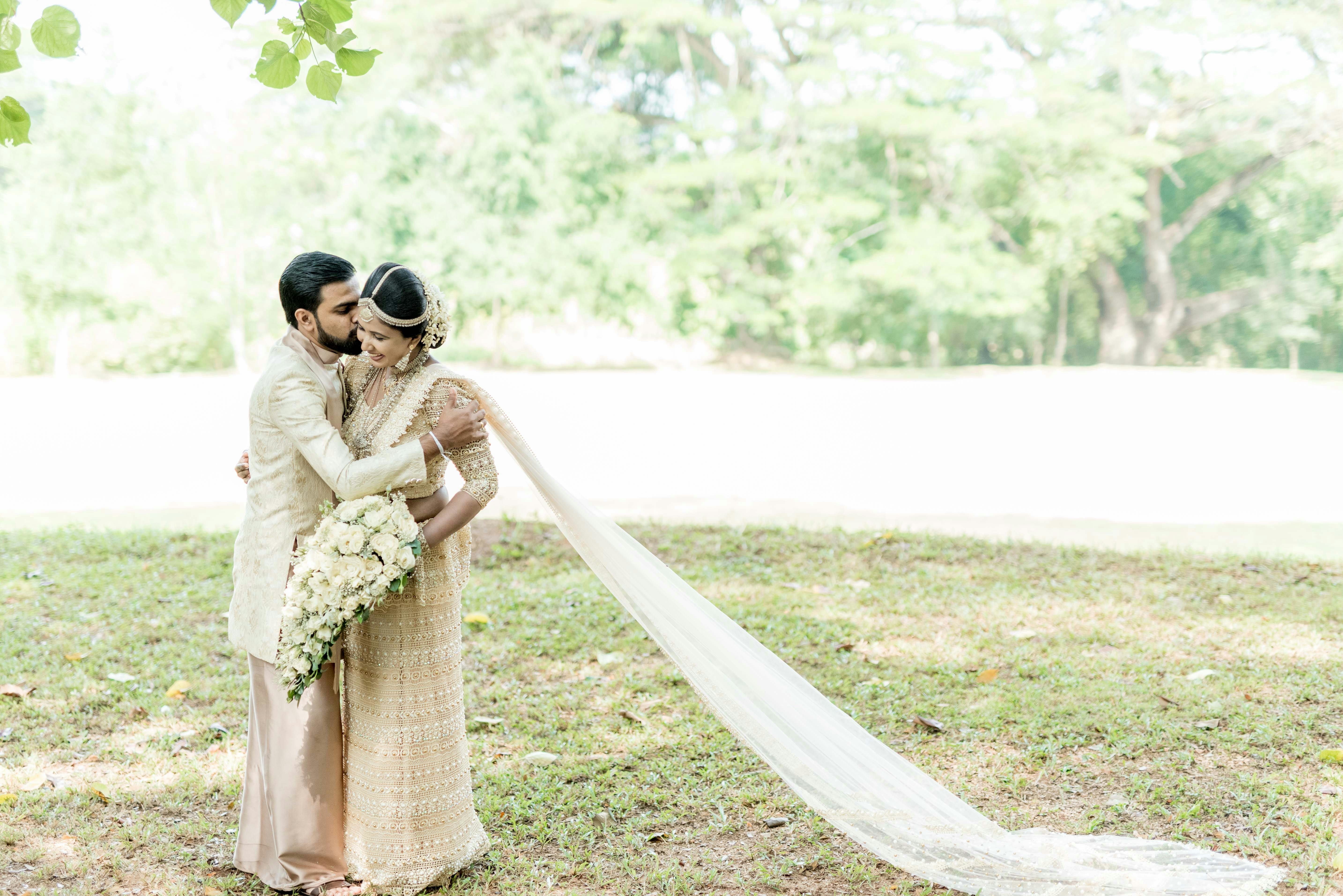 A bride and groom pose for a wedding photo photo – Free People Image on ...