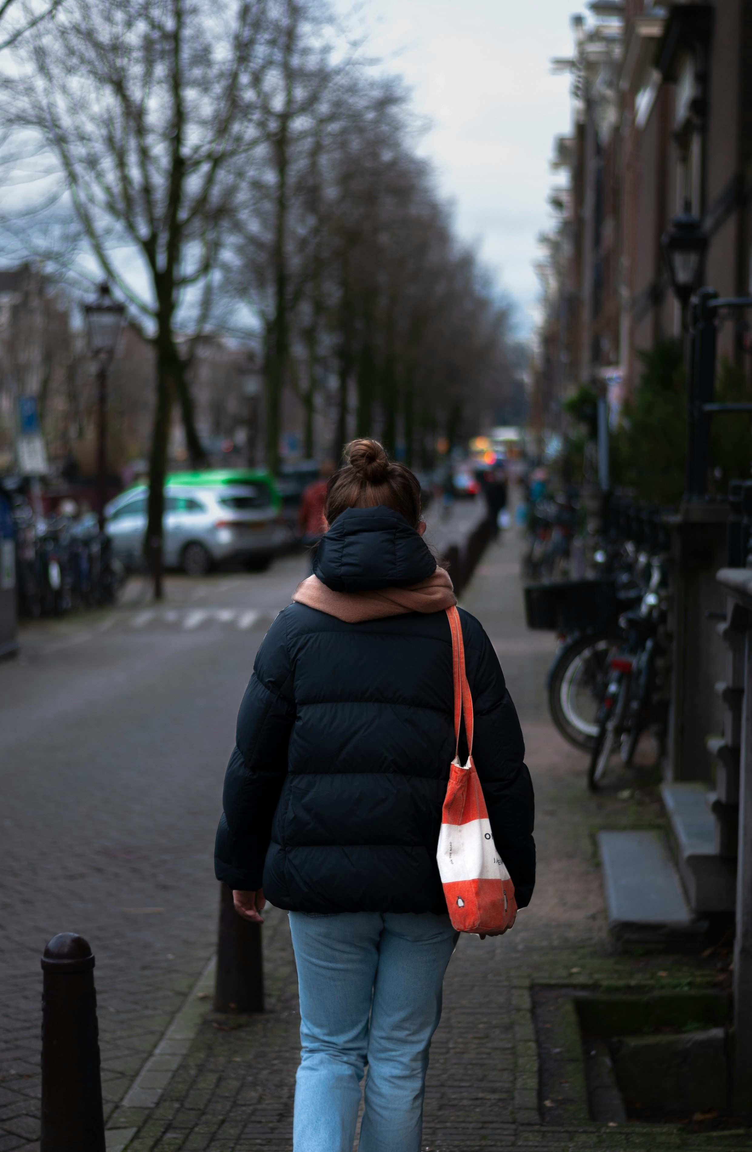Back-View Stroll on a Quiet City Block in Winter Light