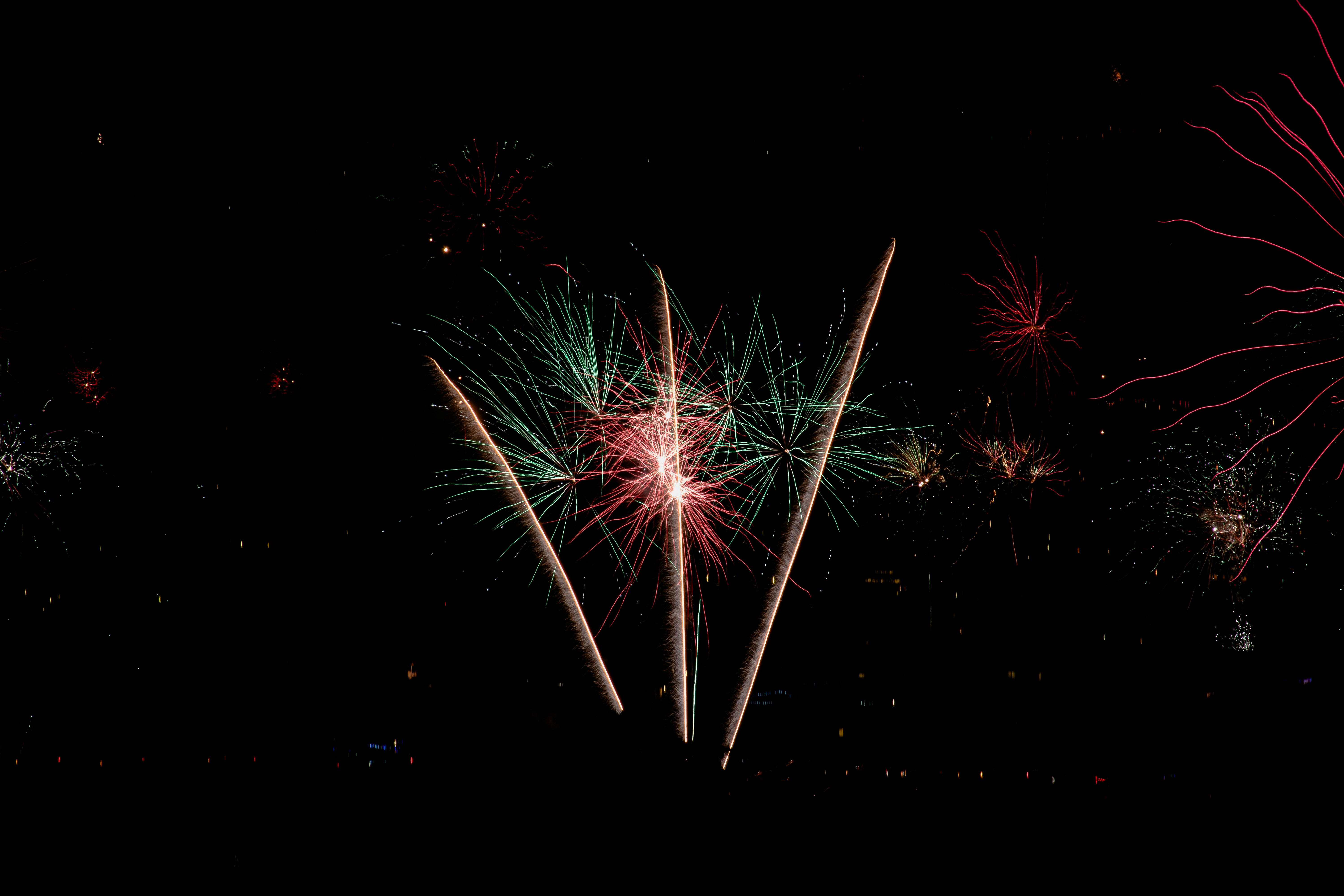 Red and white fireworks during nighttime photo – Free Night Image on ...