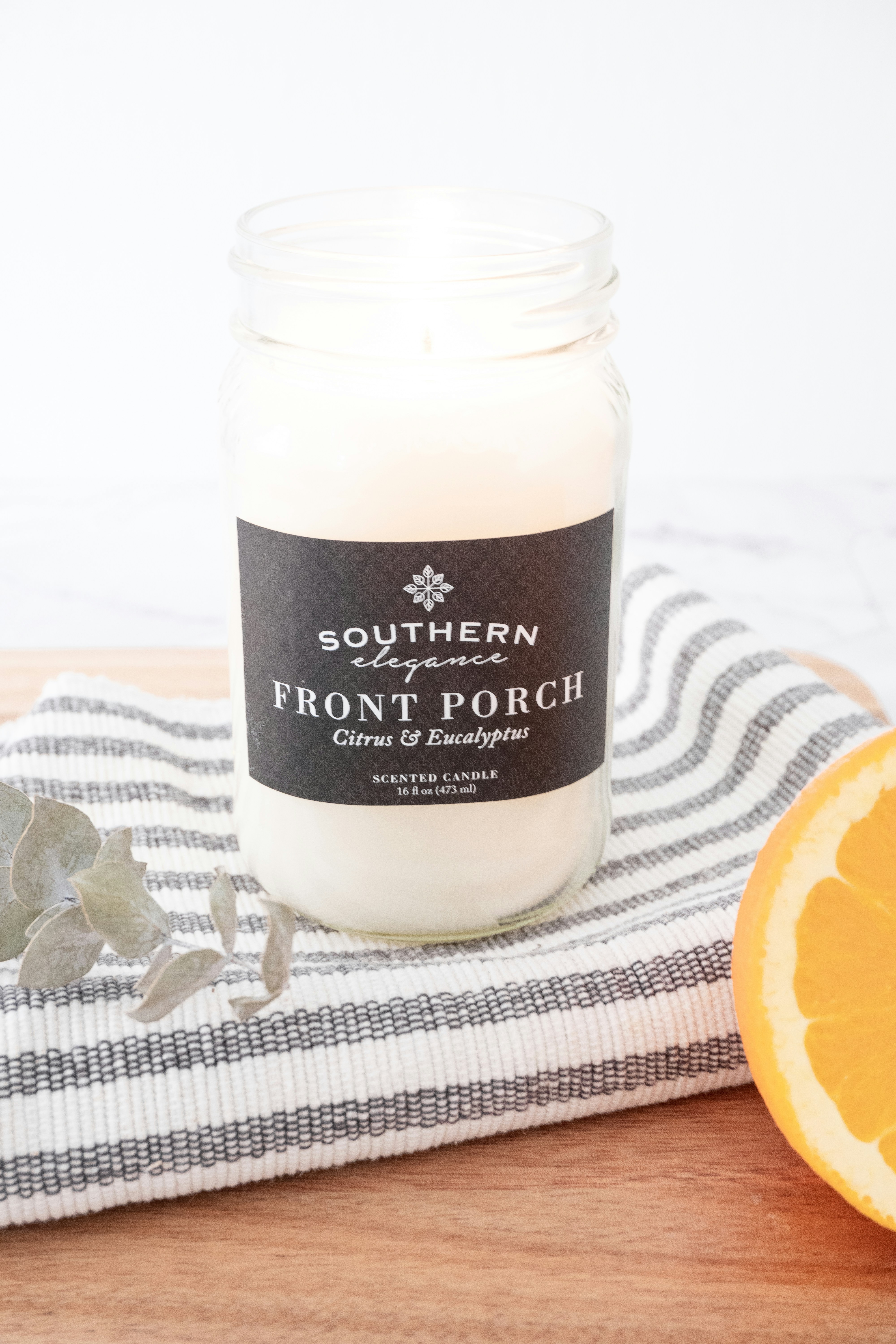 Citrus Glow: Front Porch Candle in Soft Studio Light