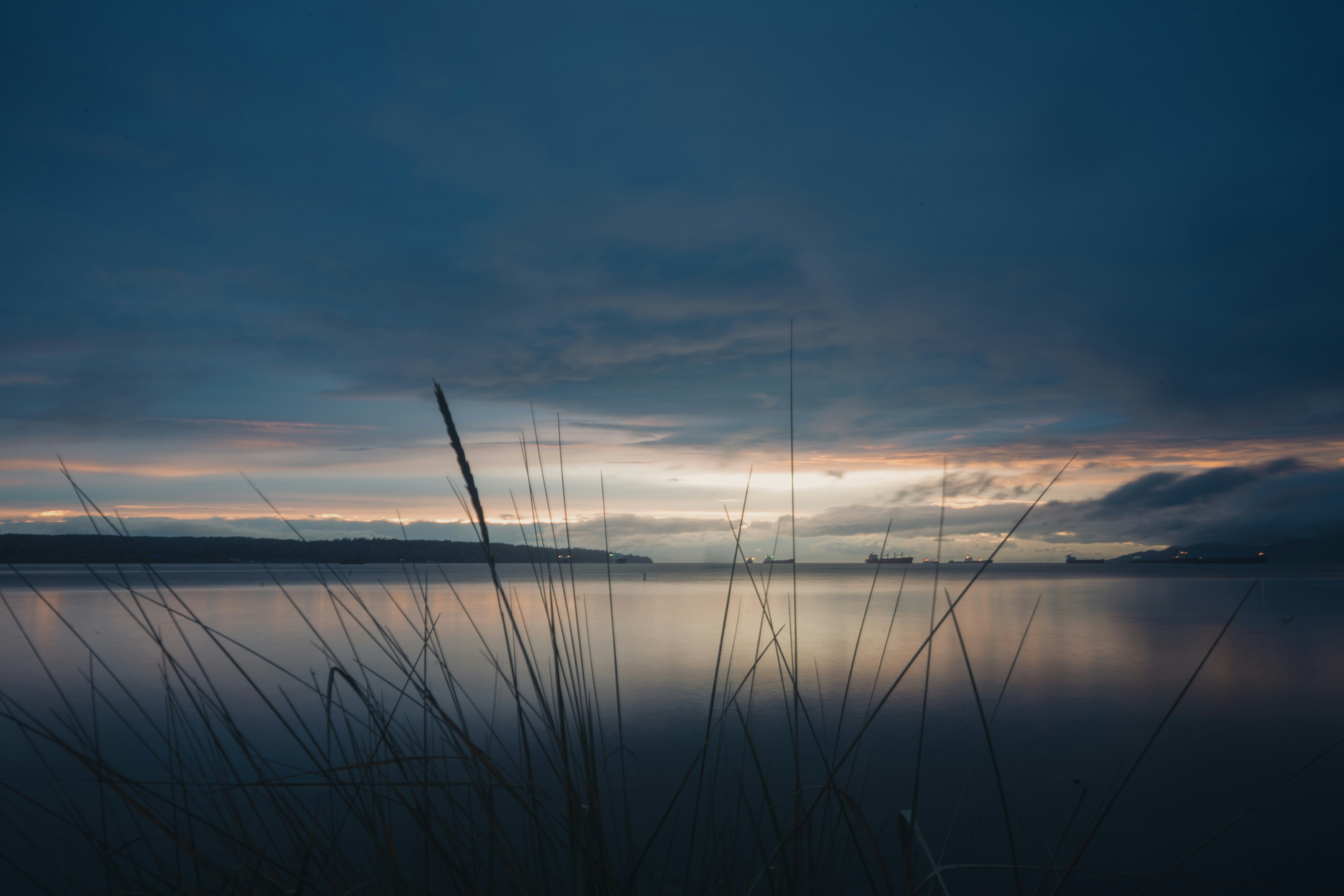 Dusk on a Glassy Lake: A Quiet Blue Horizon