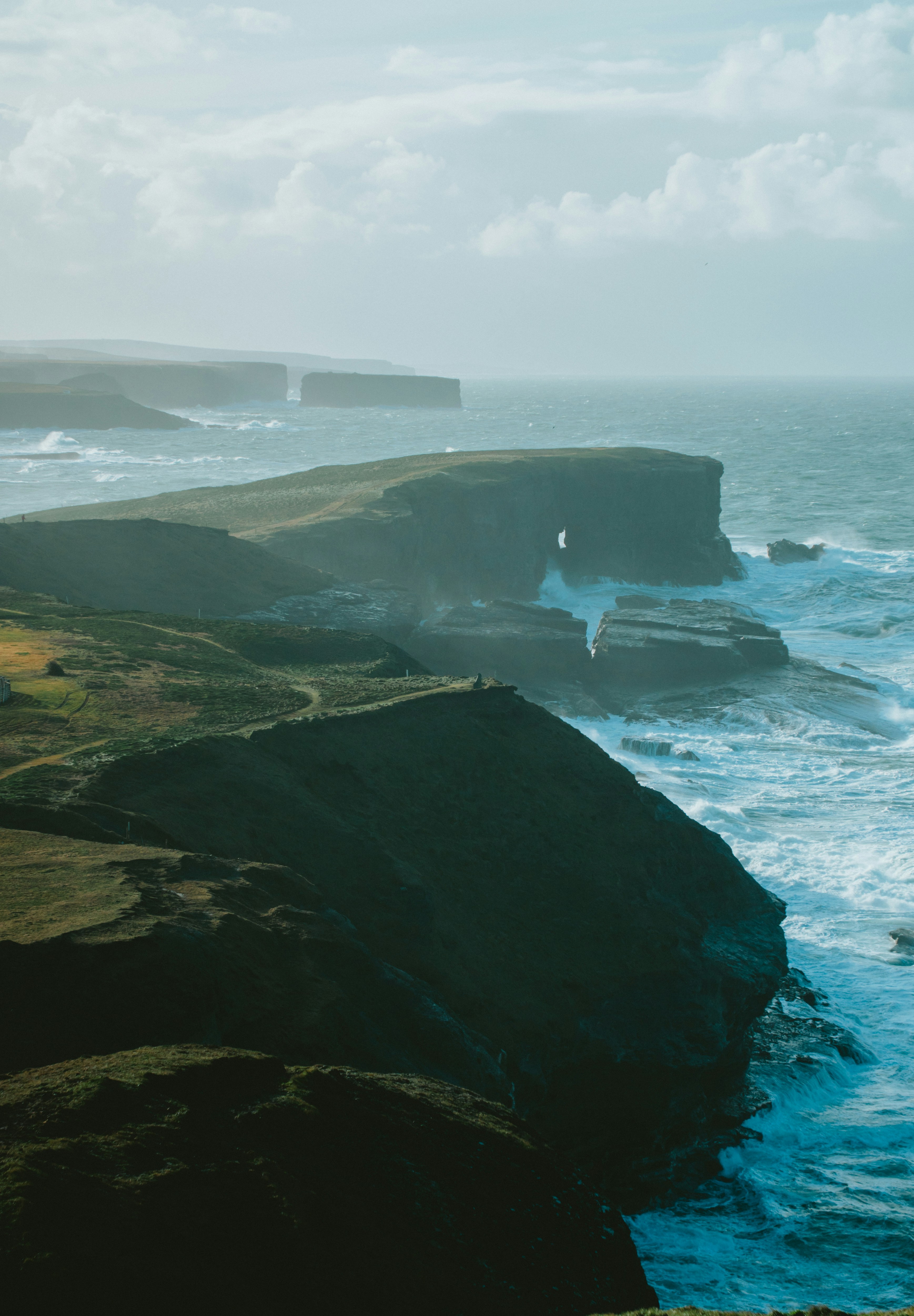 Green mountain beside body of water during daytime photo – Free Kilkee ...