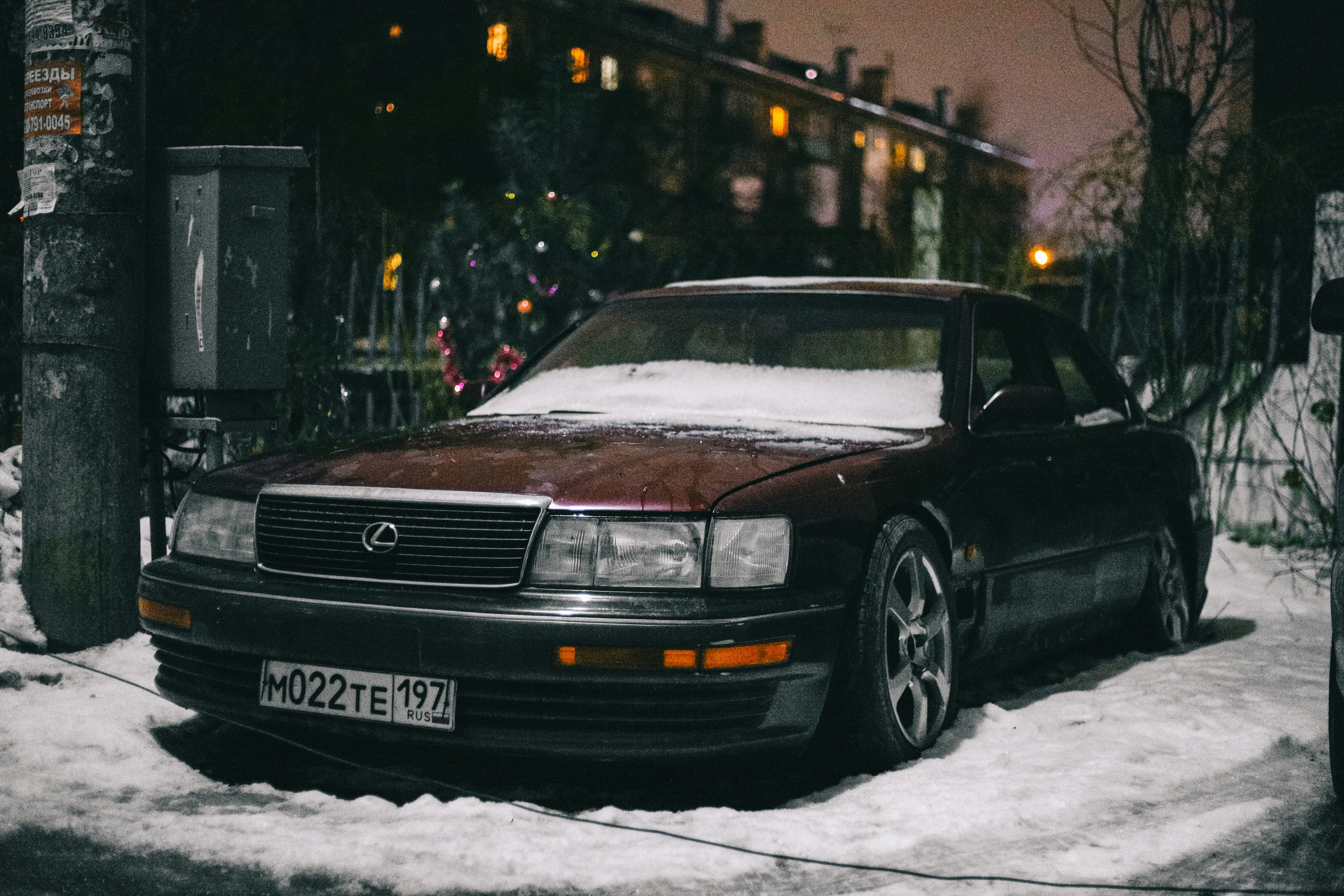 black bmw m 3 coupe on snow covered road during night time