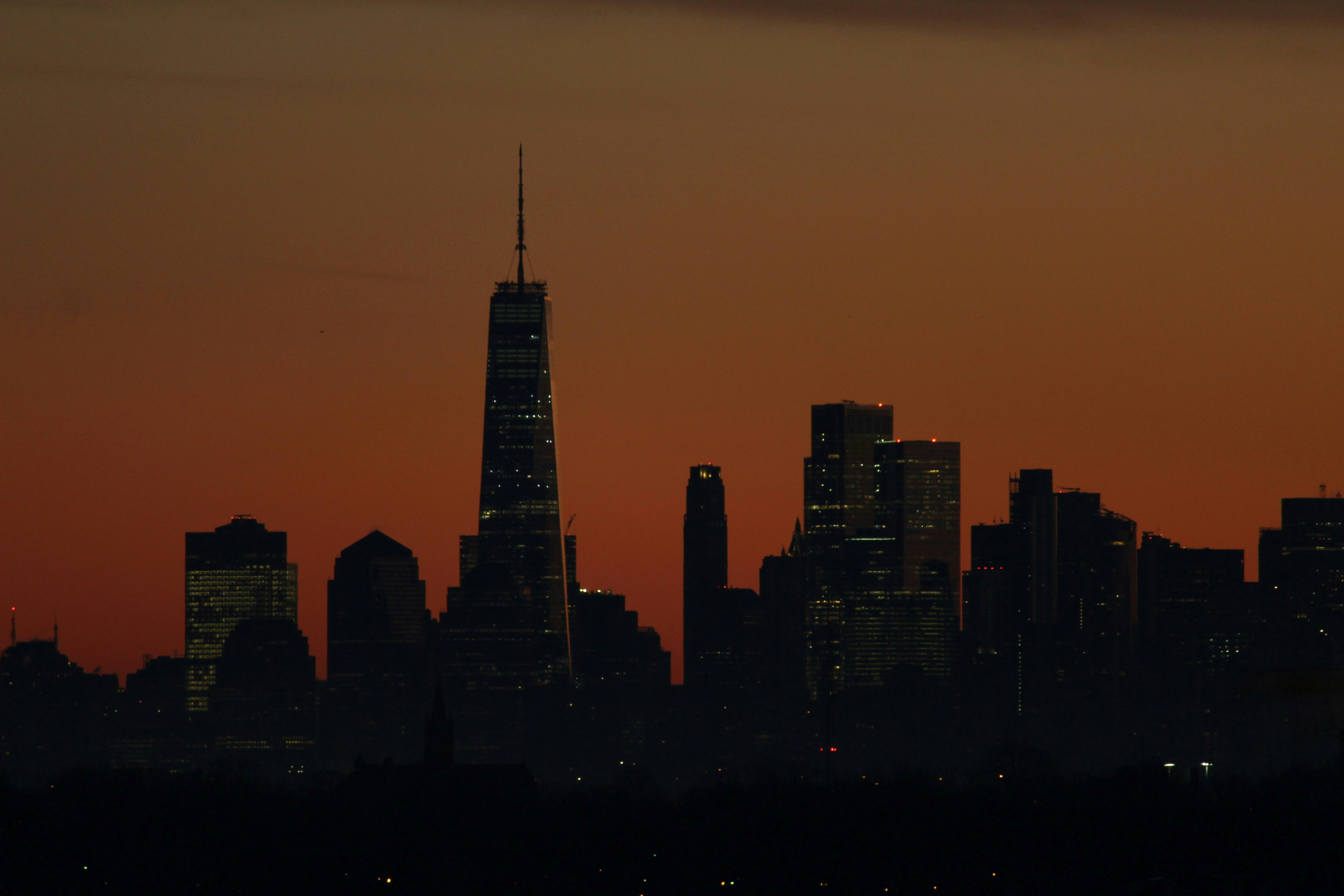 Dusk Spire Over a Tangerine Skyline