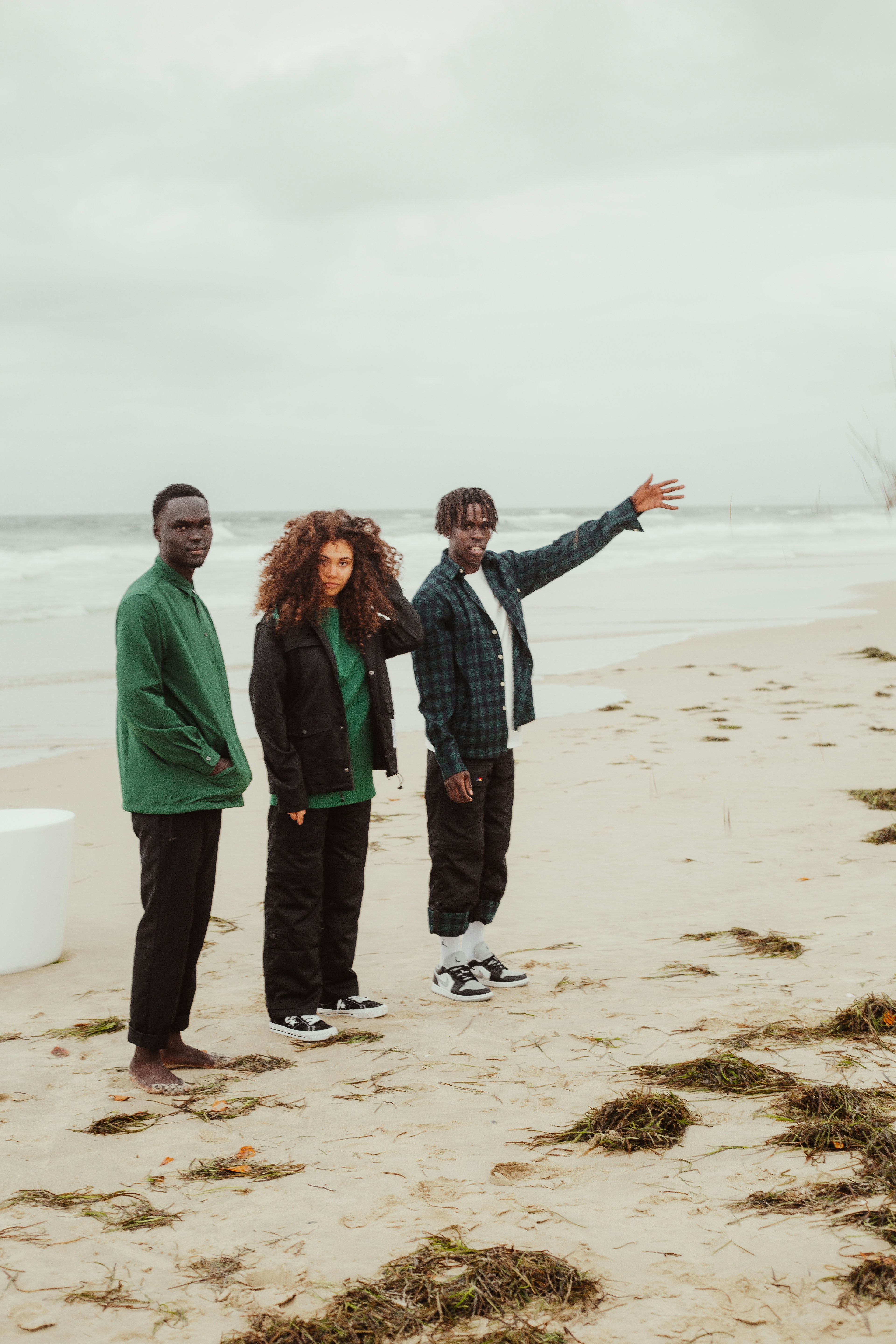 Outstretched Welcome on a Windy Beach: A Trio Portrait