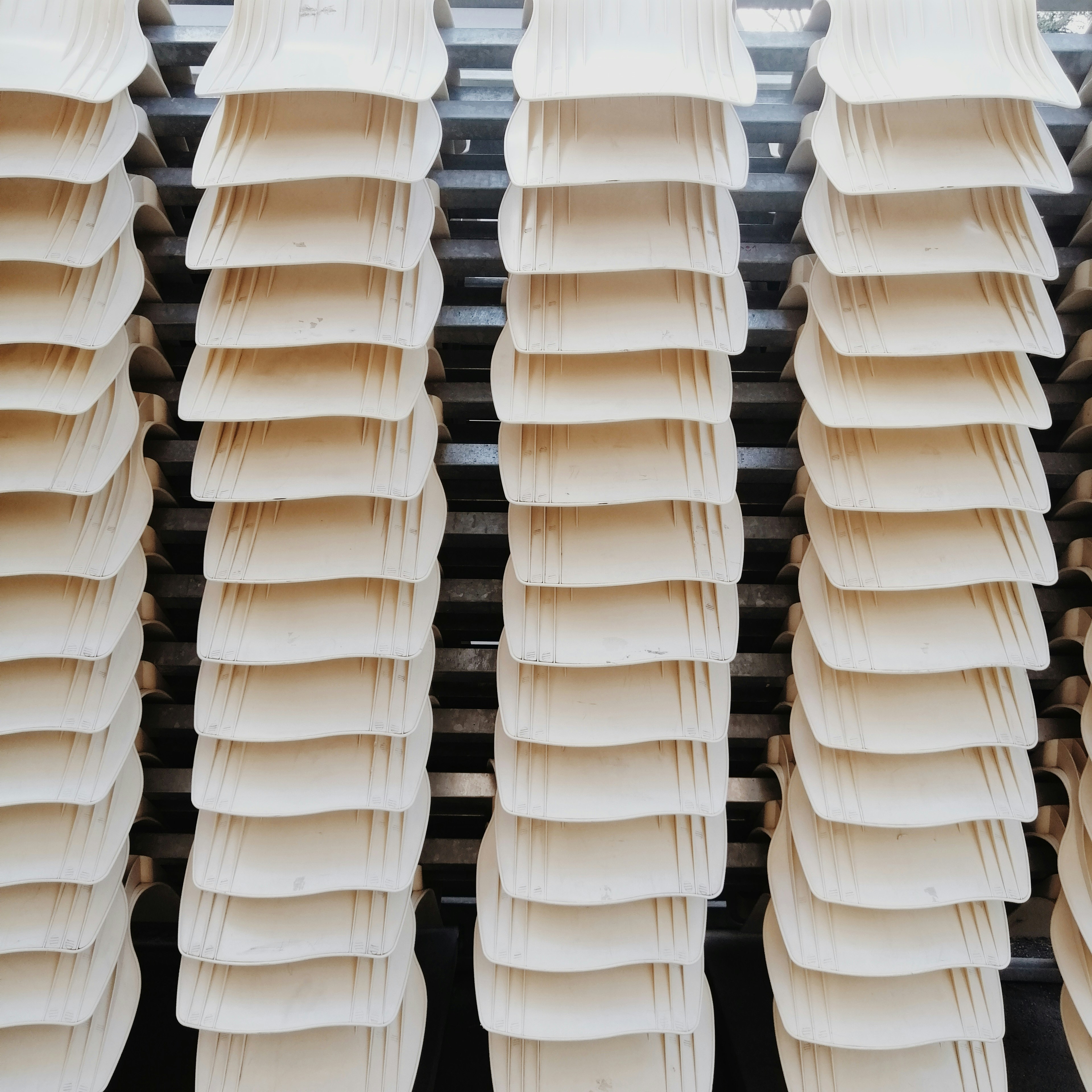 Neatly arranged wooden spoons showcasing craftsmanship and design in a workshop setting.