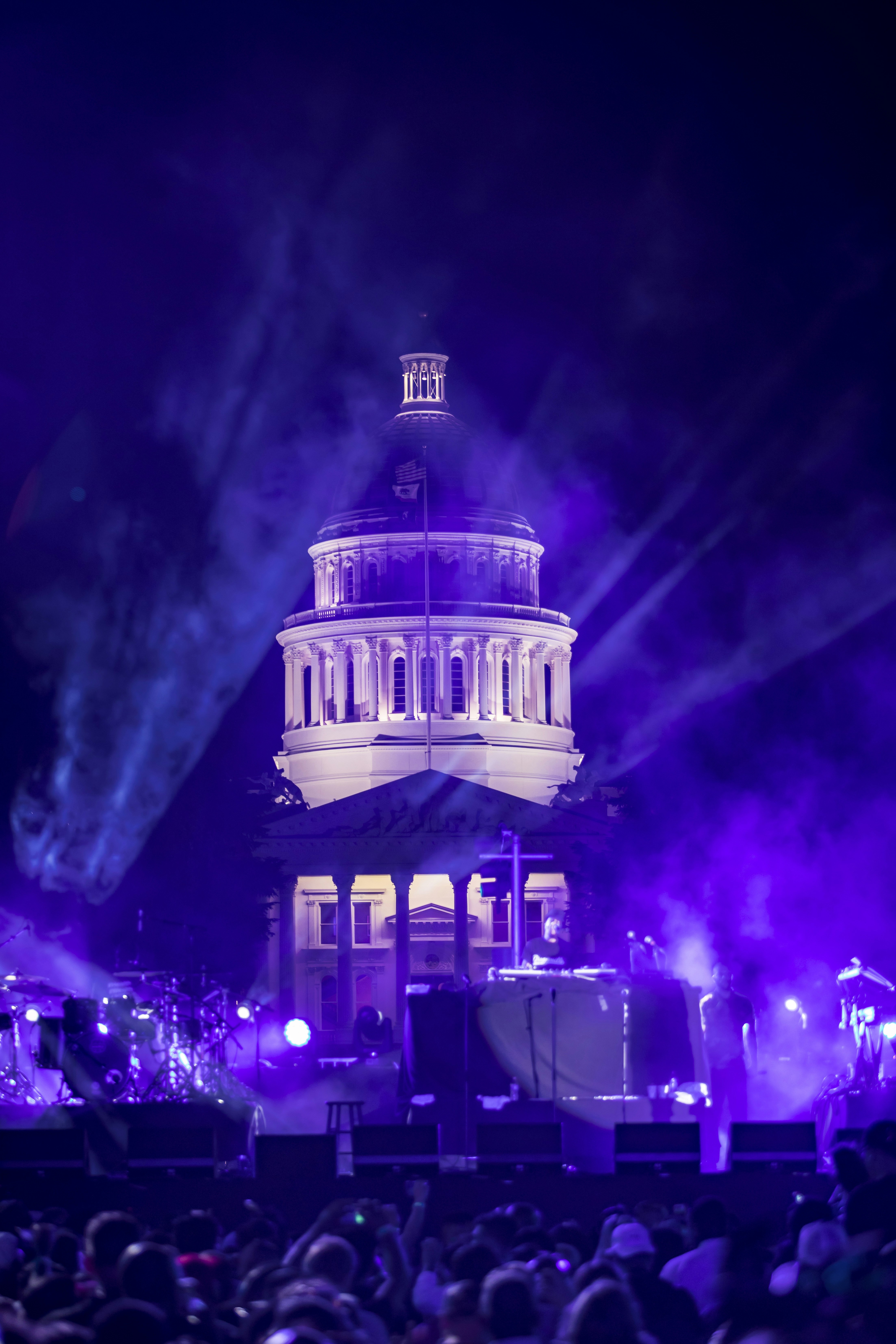 Purple Spotlight Over the Capitol Dome: Night Concert Beneath Smoke