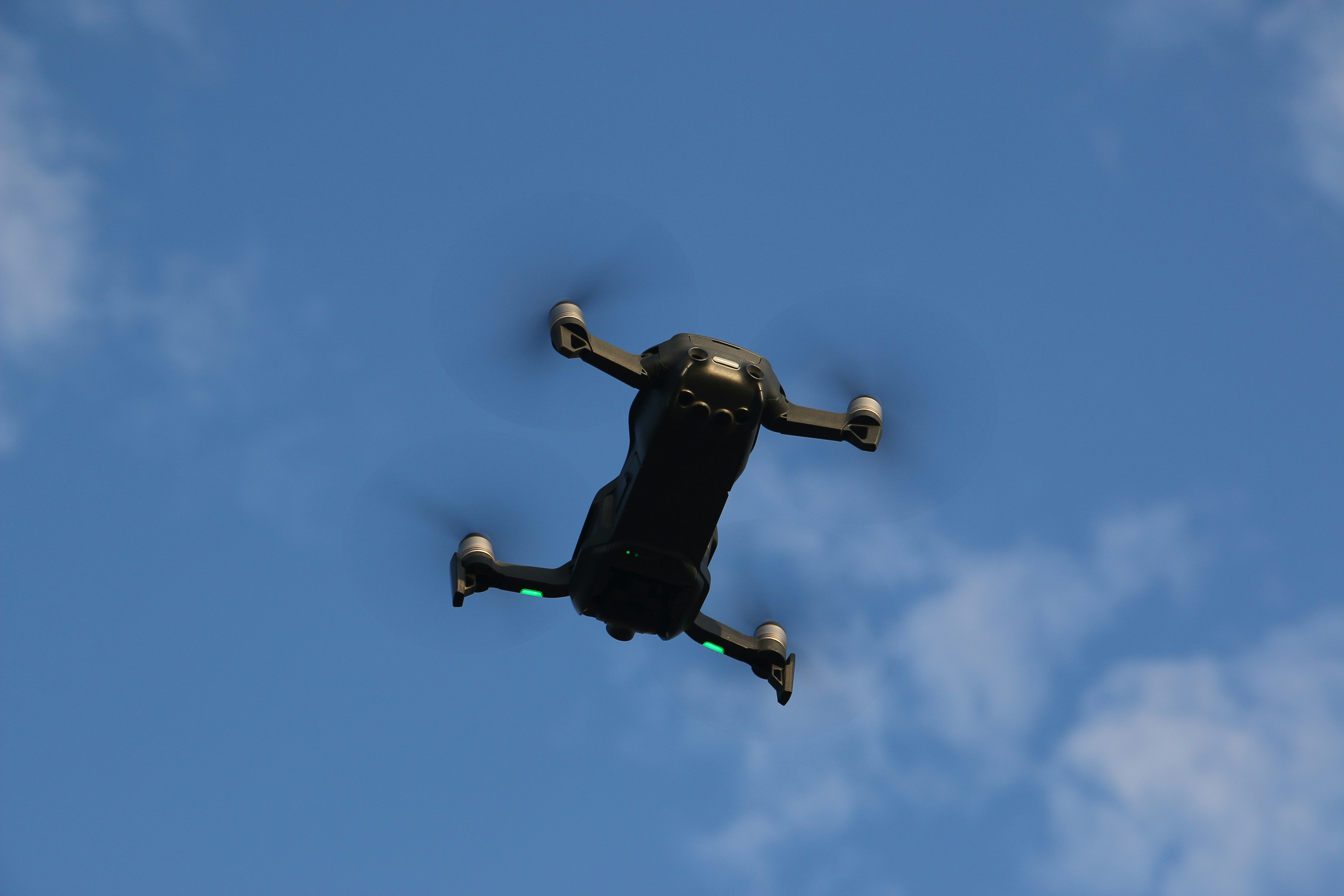 Midday Hover: A Quadrotor Trims the Sky in Crisp Blue