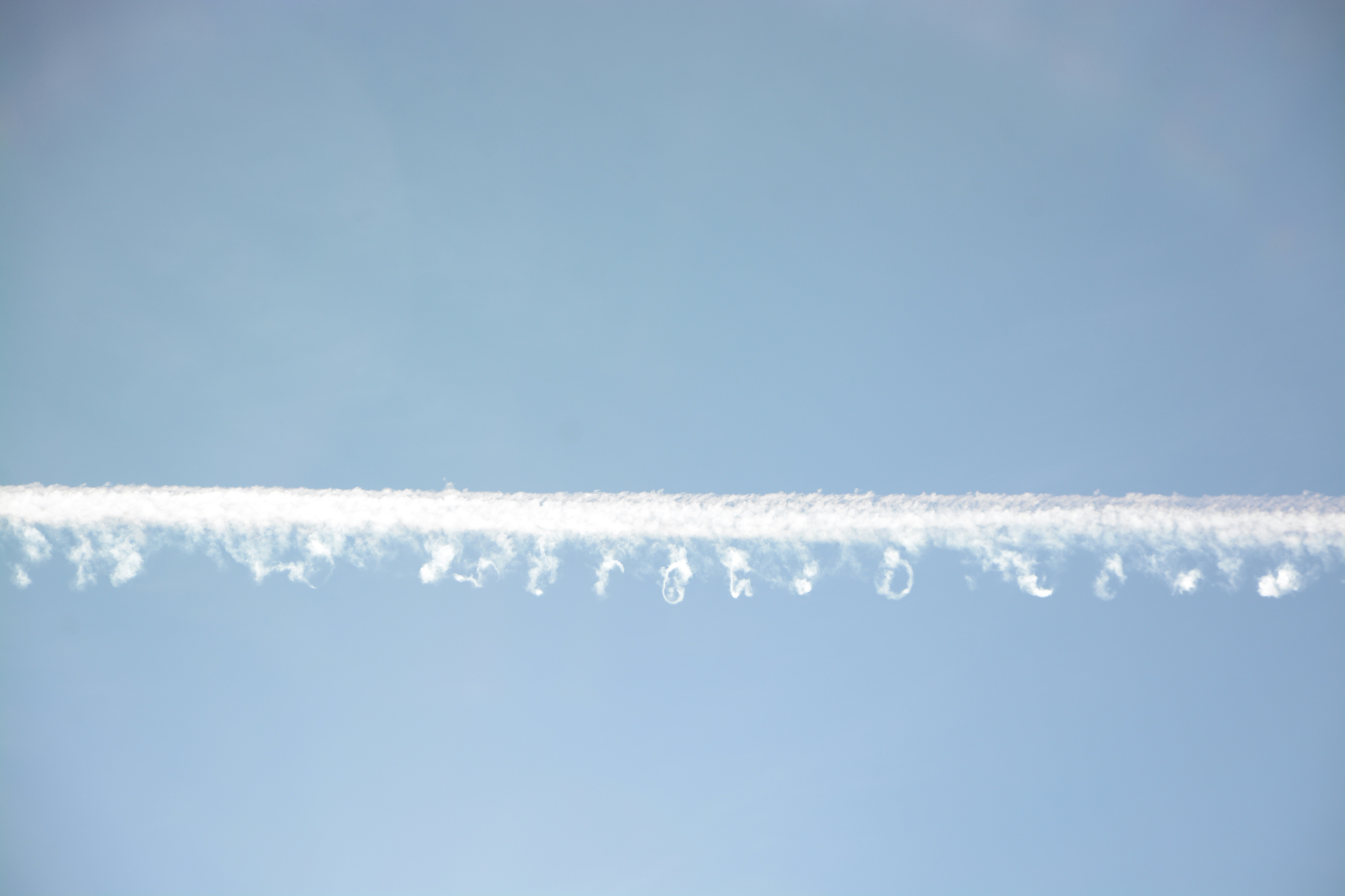 Iced Ribbon Across a Quiet Azure Sky