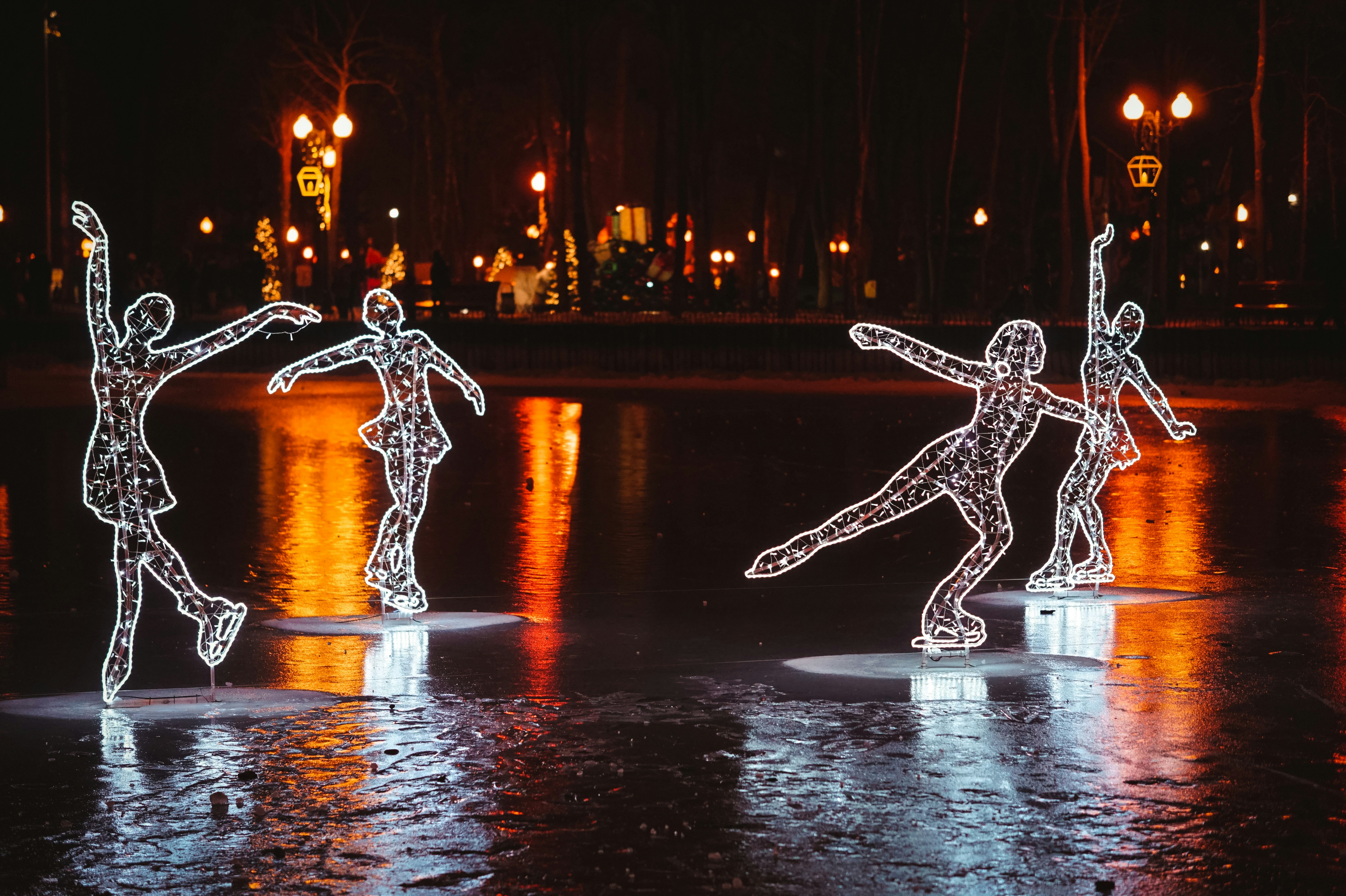 Glowing Ice Dancers in a Quiet Night Park