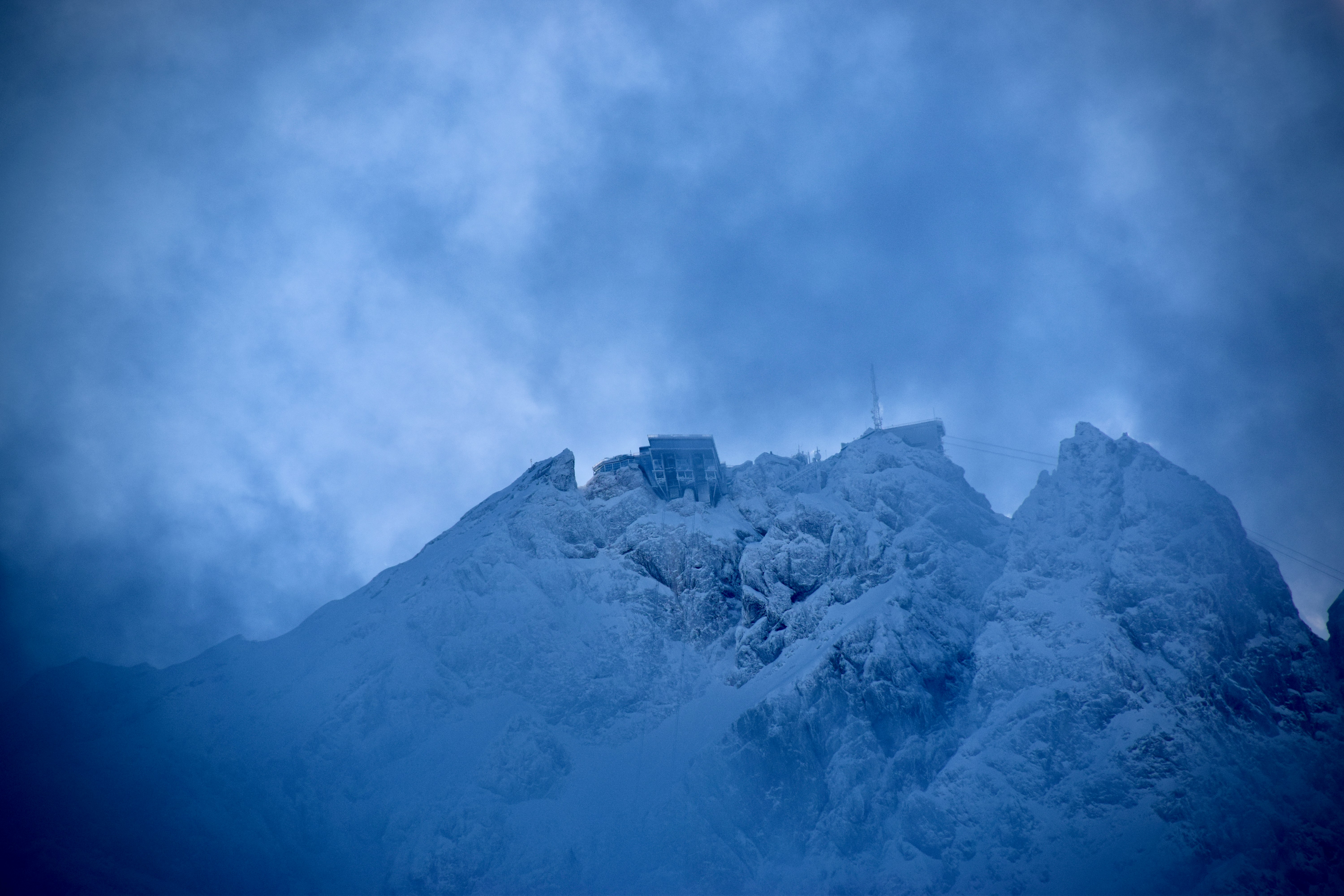 Blue Summit Crown: Snow, Sky, and Silent Prominence