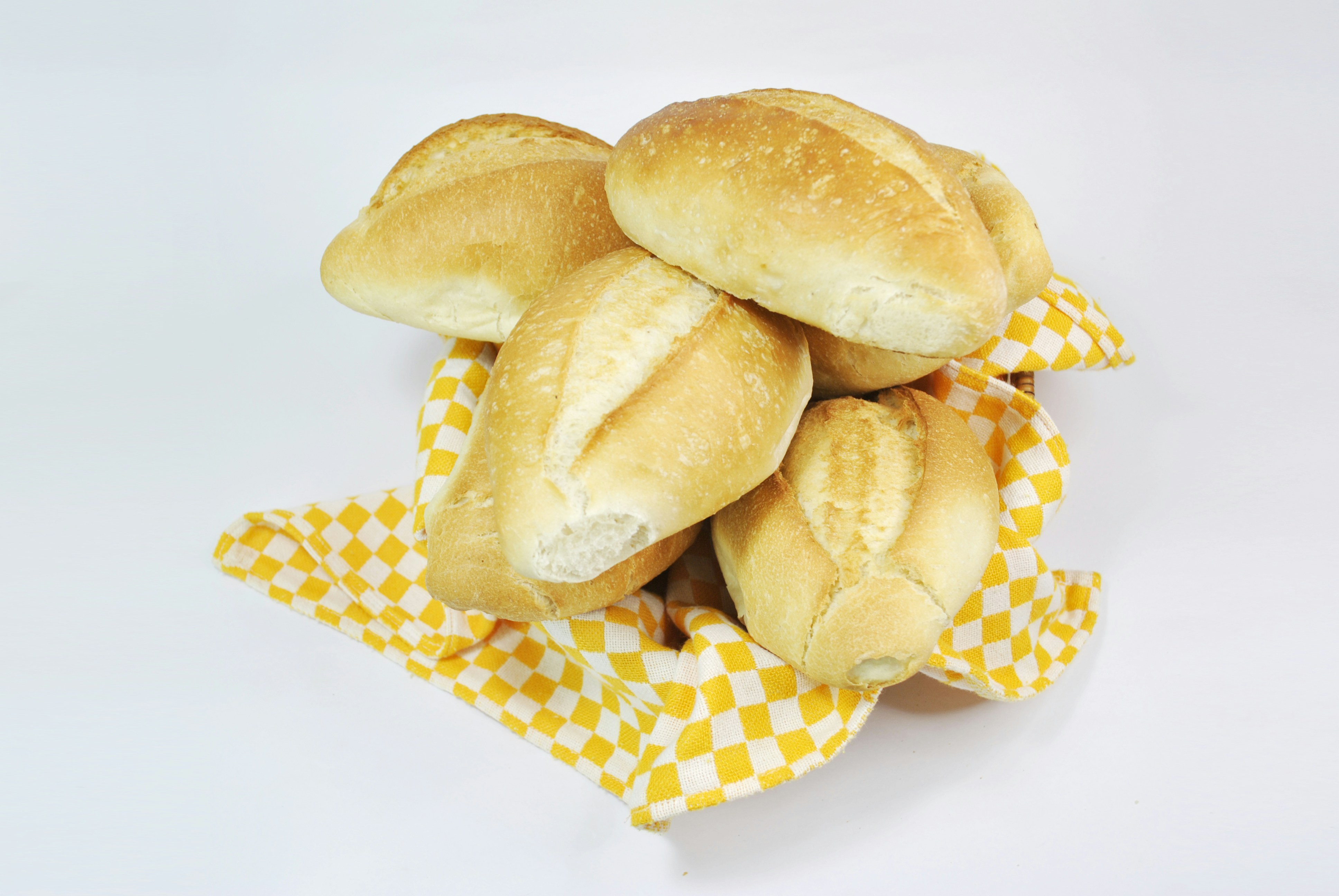 Three bread on white and yellow checkered textile photo – Free Bread ...