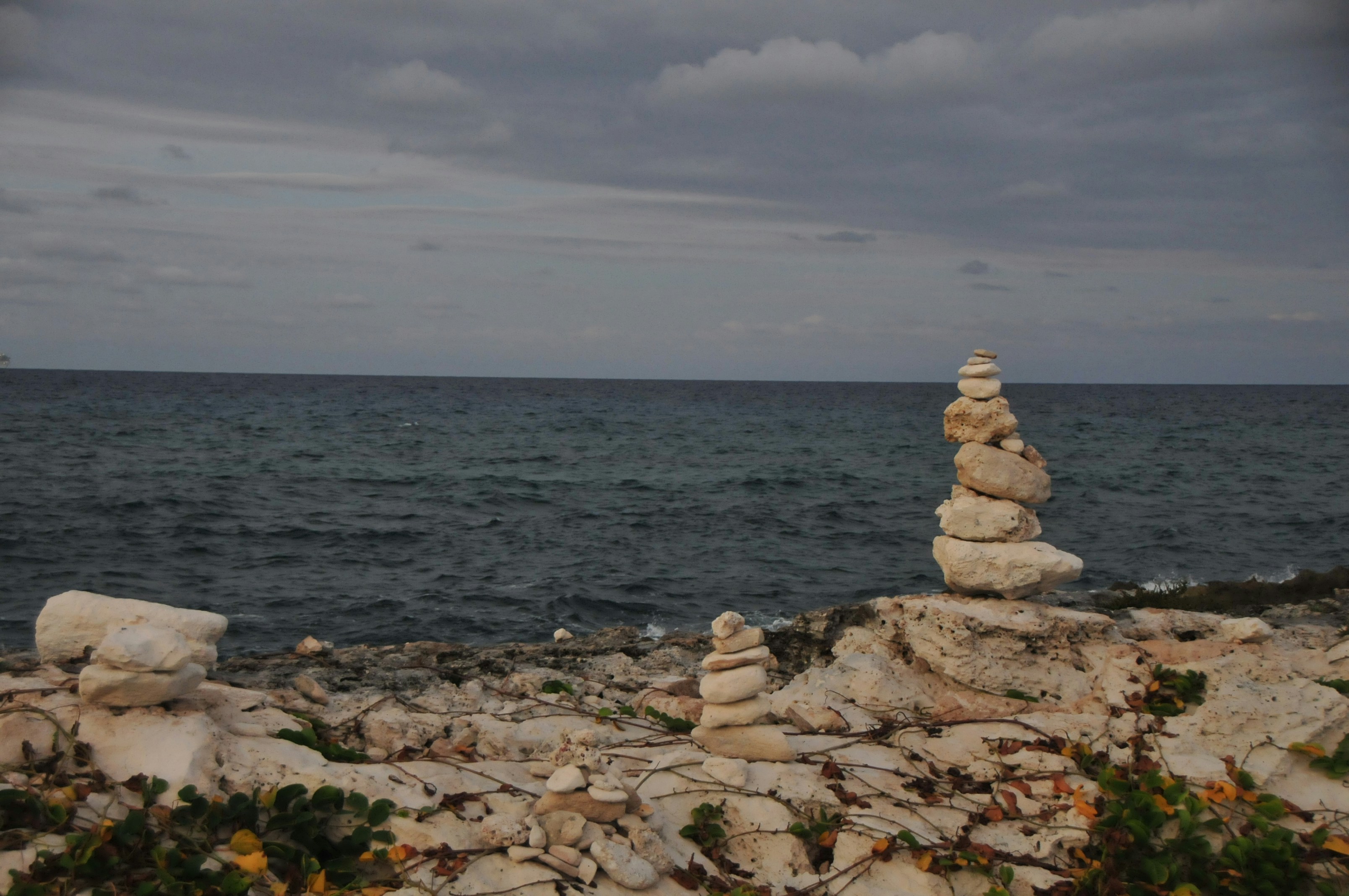 Stone Cairns by the Quiet Sea