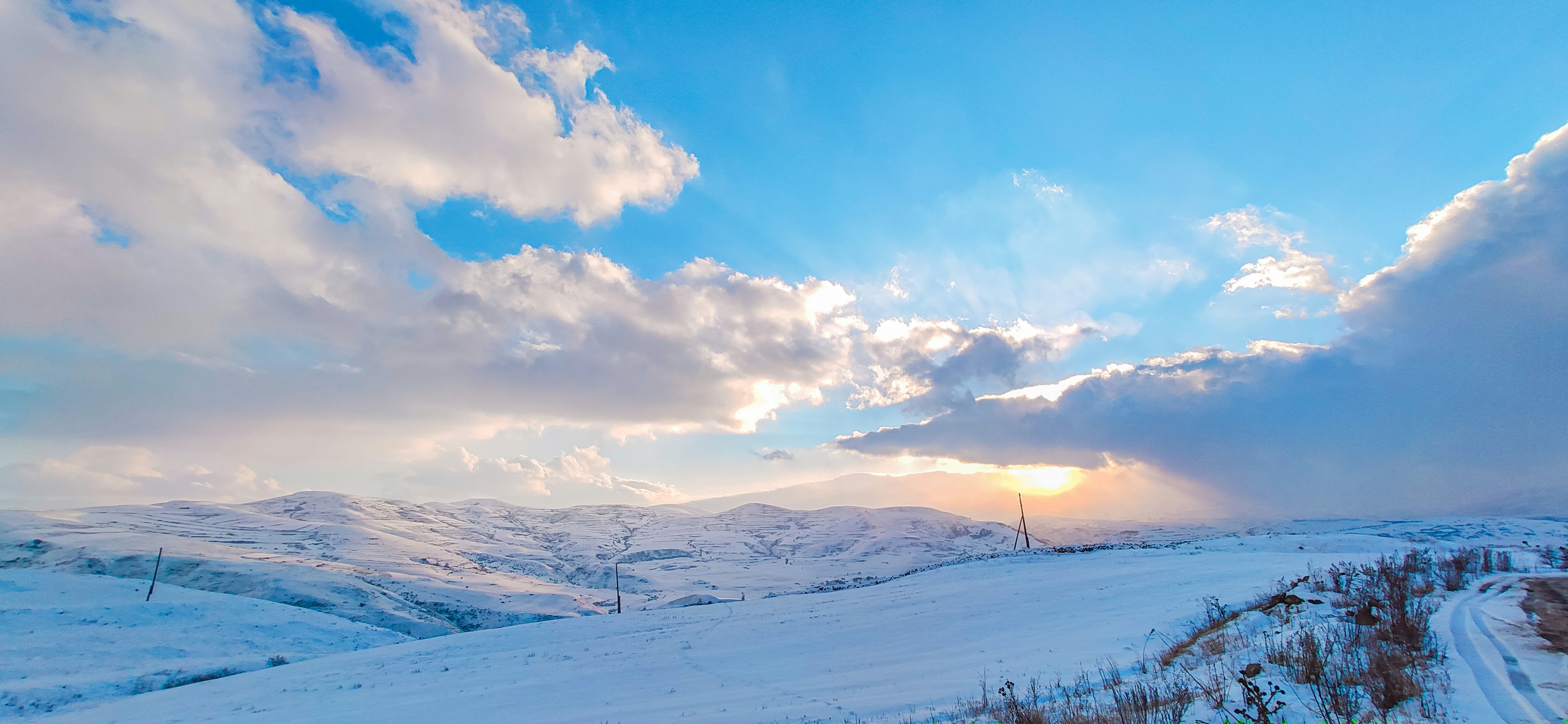 Snow covered mountains under cloudy sky during daytime photo – Free ...