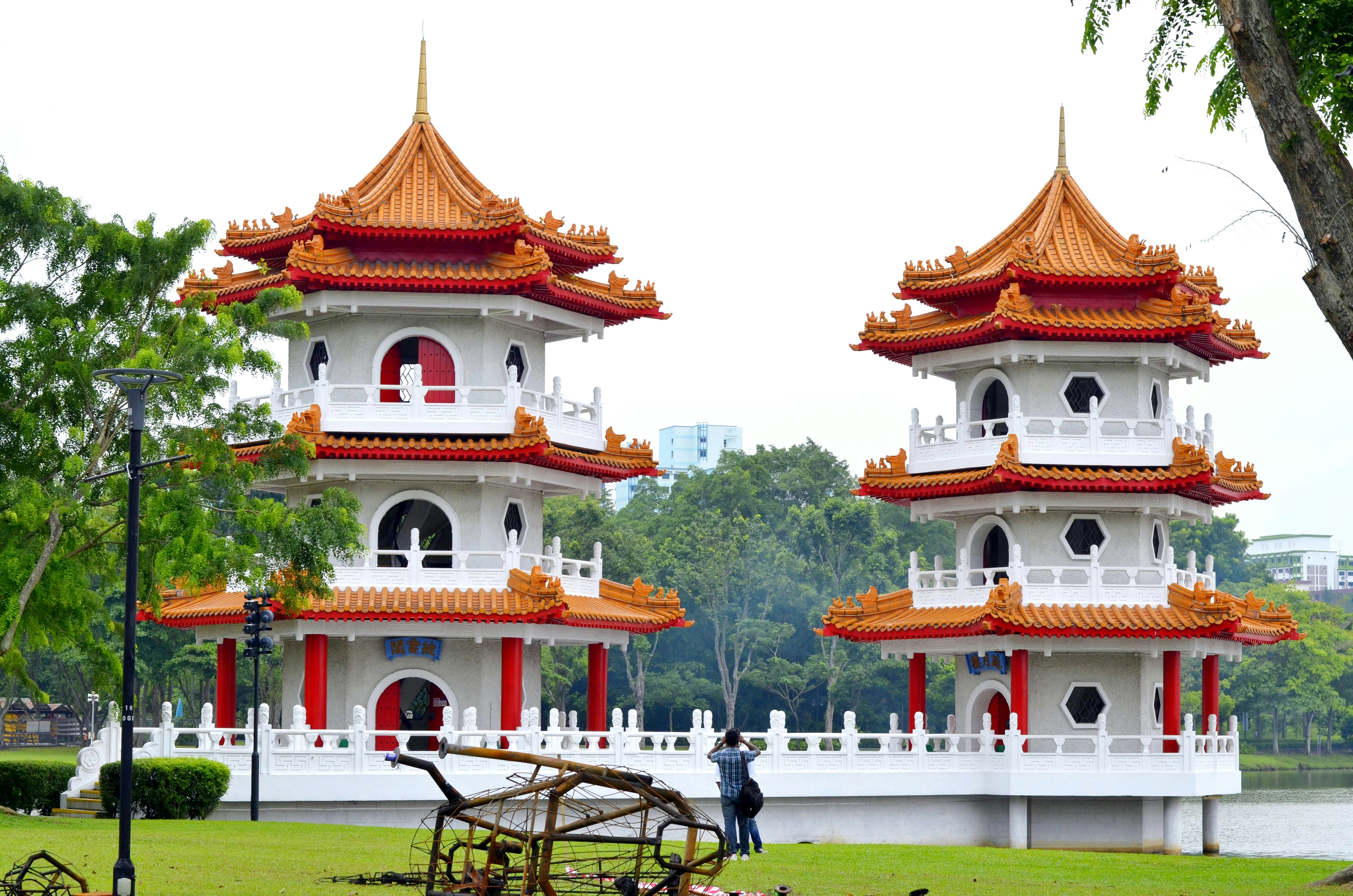 Twin Pagodas by the Park Lake: Red Roofs, Quiet Geometry