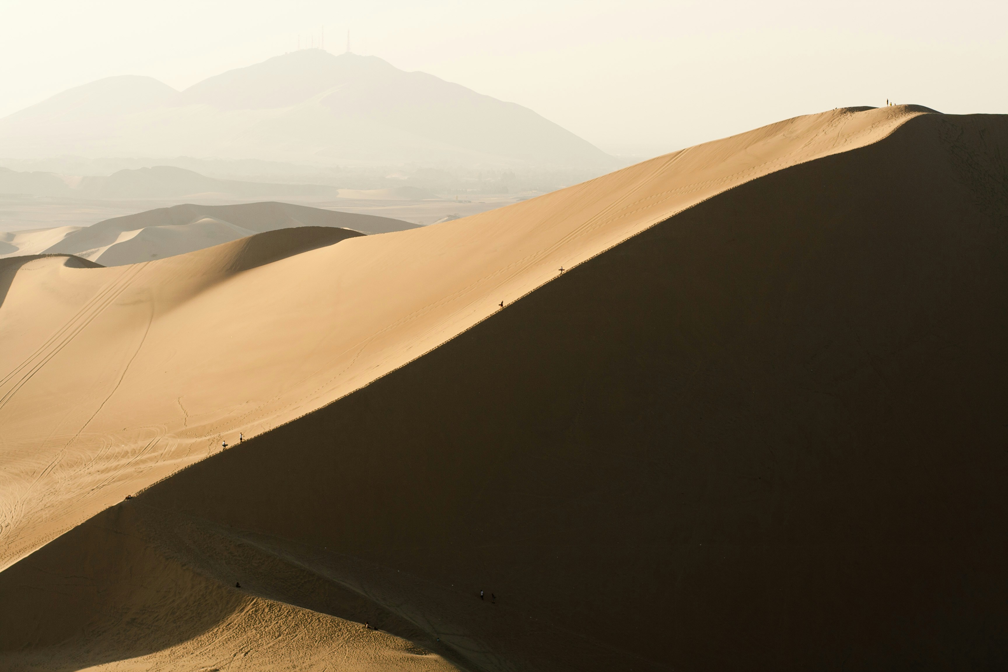 Rippled Silence: A Golden Crest Beneath the Distant Horizon
