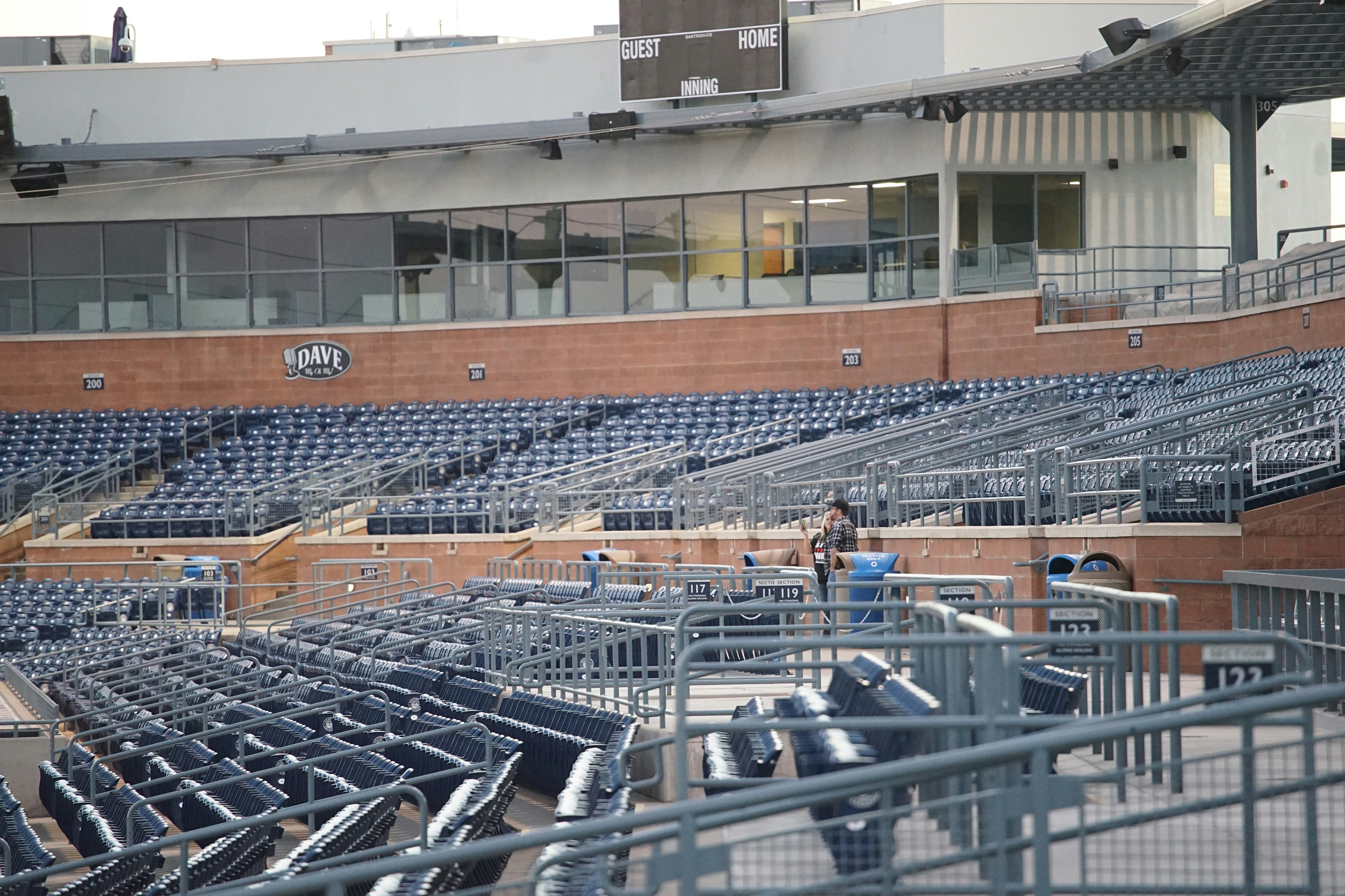 Between the Ranks: A Quiet Moment in the Blue Stadium