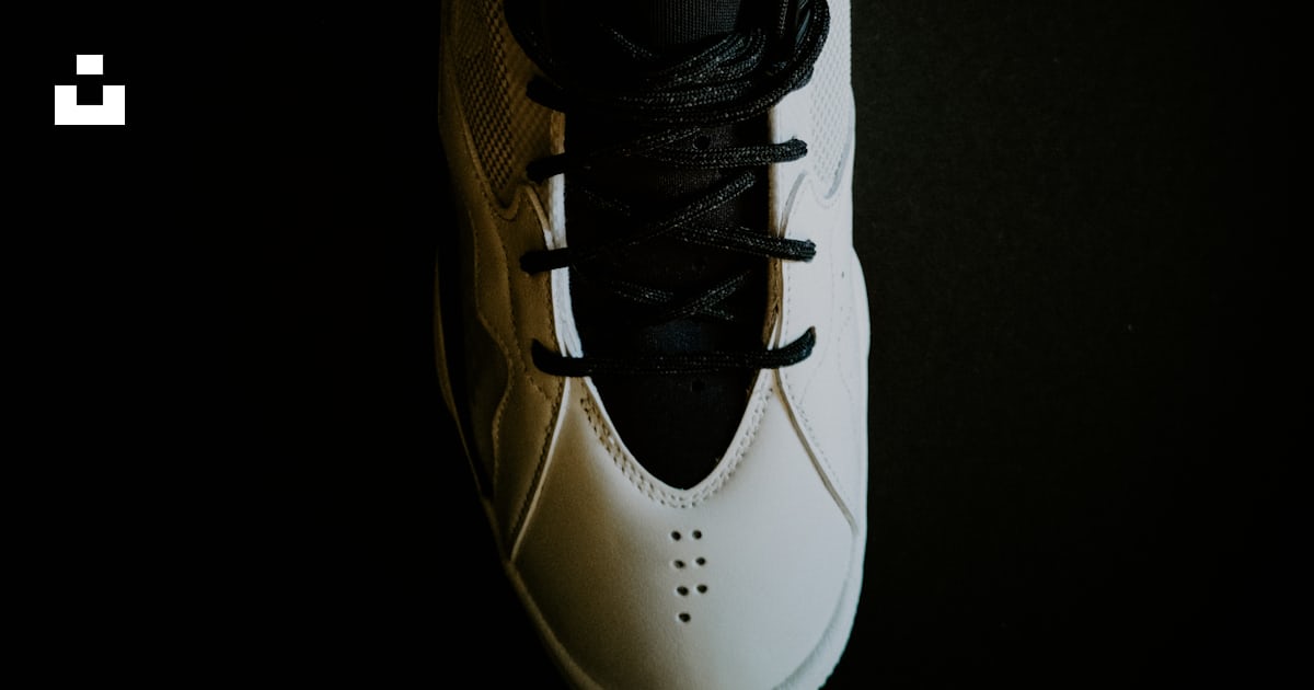 White And Black Nike Athletic Shoe Photo Free Shoes Image On Unsplash