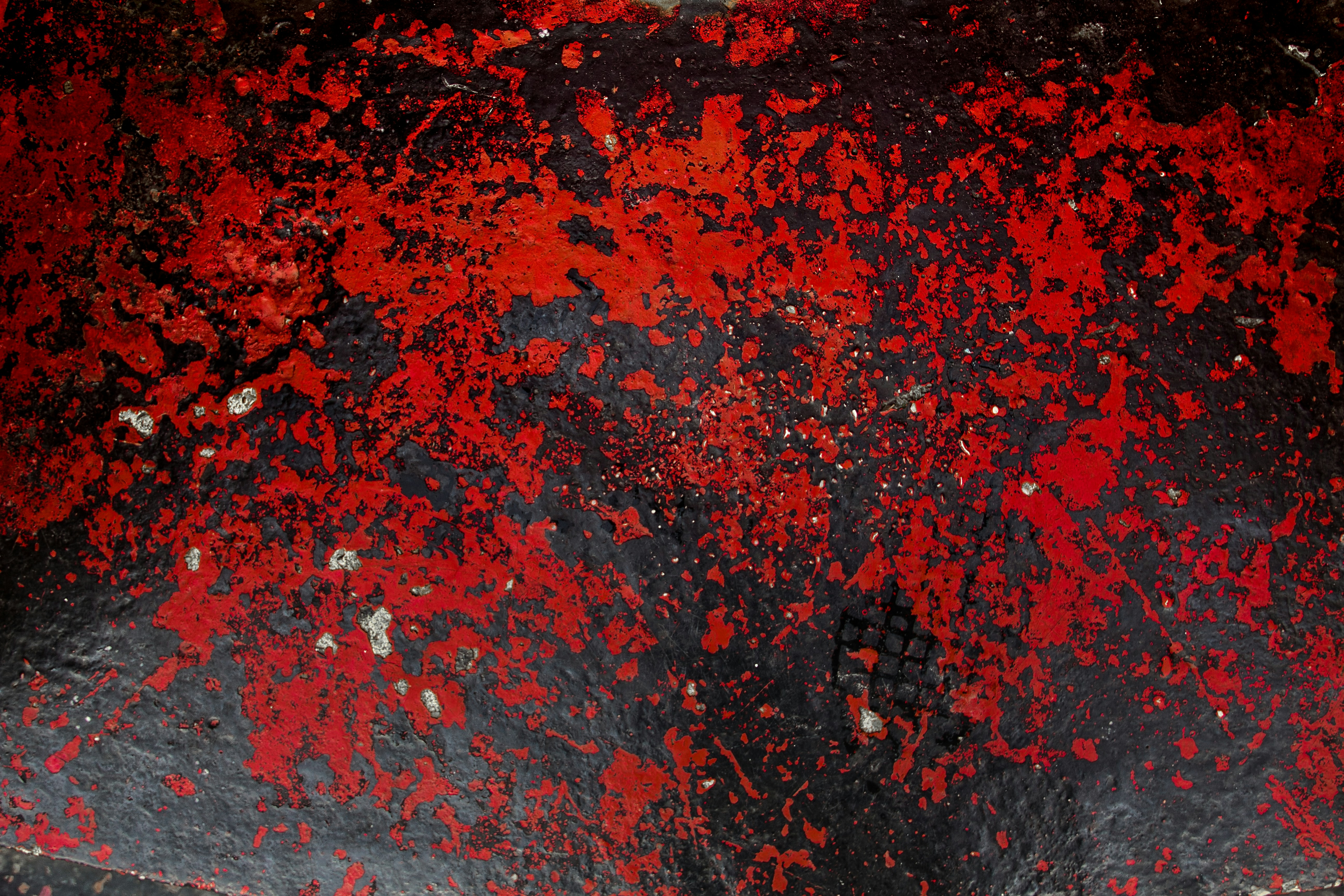 A close up of a red and black object photo – Free Texture Image on Unsplash