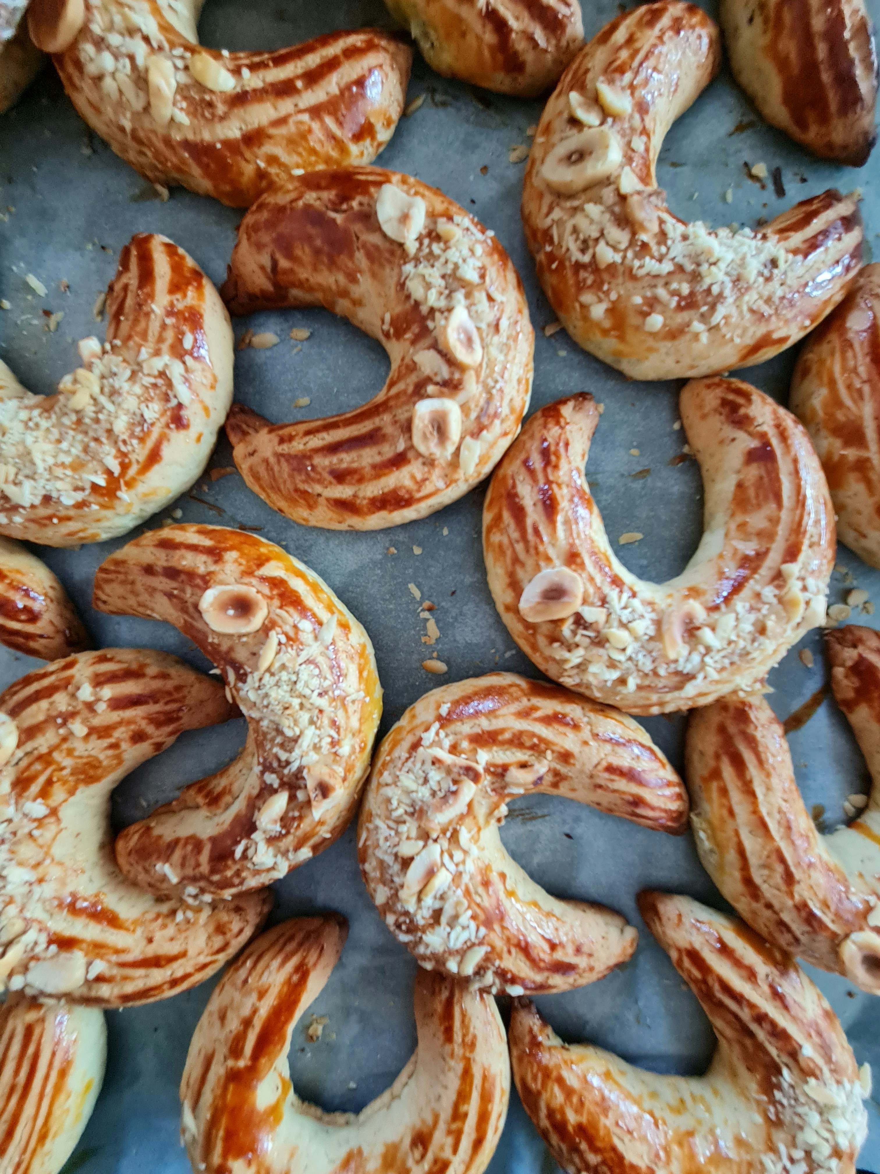 brown and white doughnut on black tray