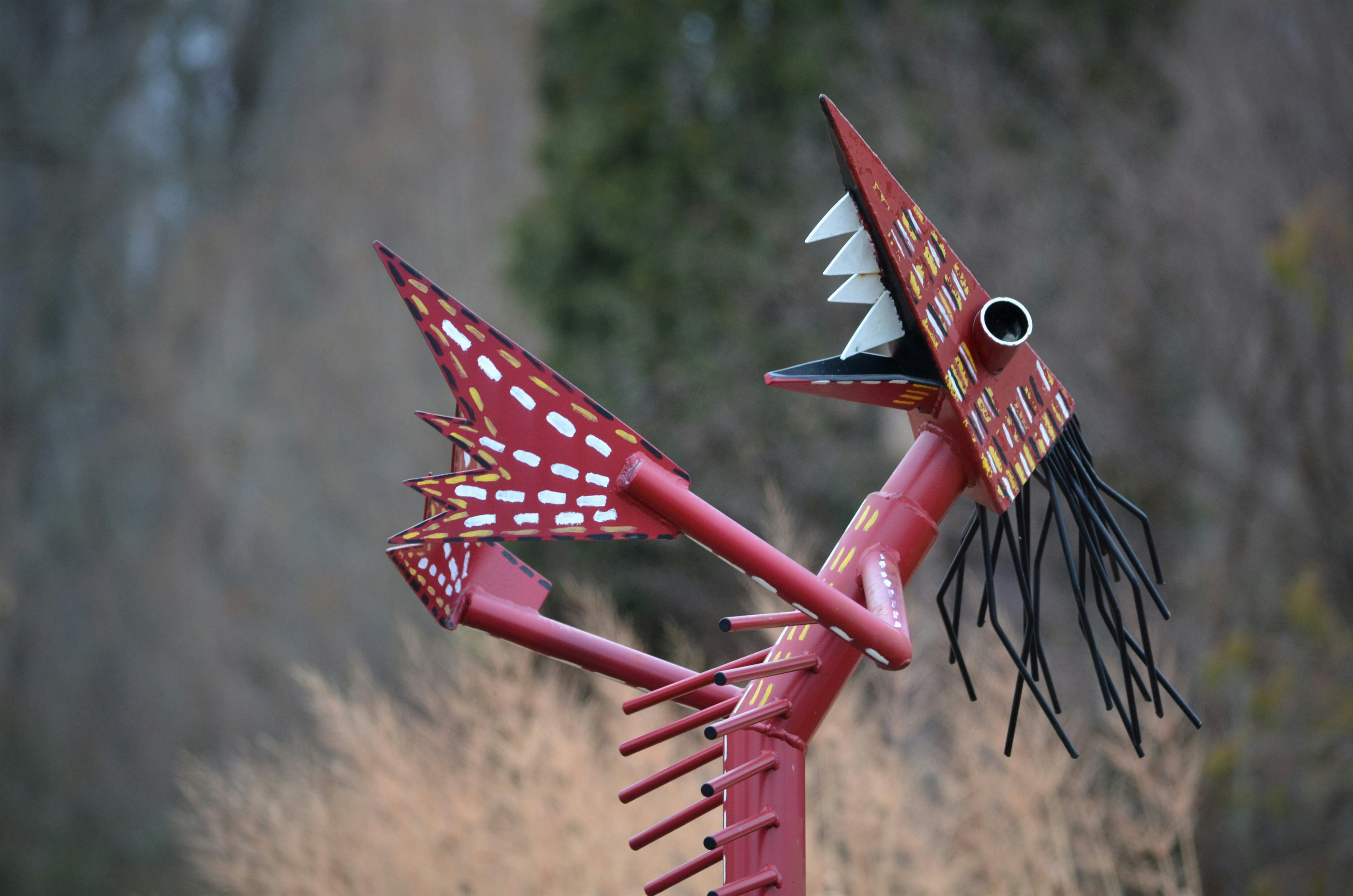 Twin Ember-Bird Metal Sculptures in a Quiet Field