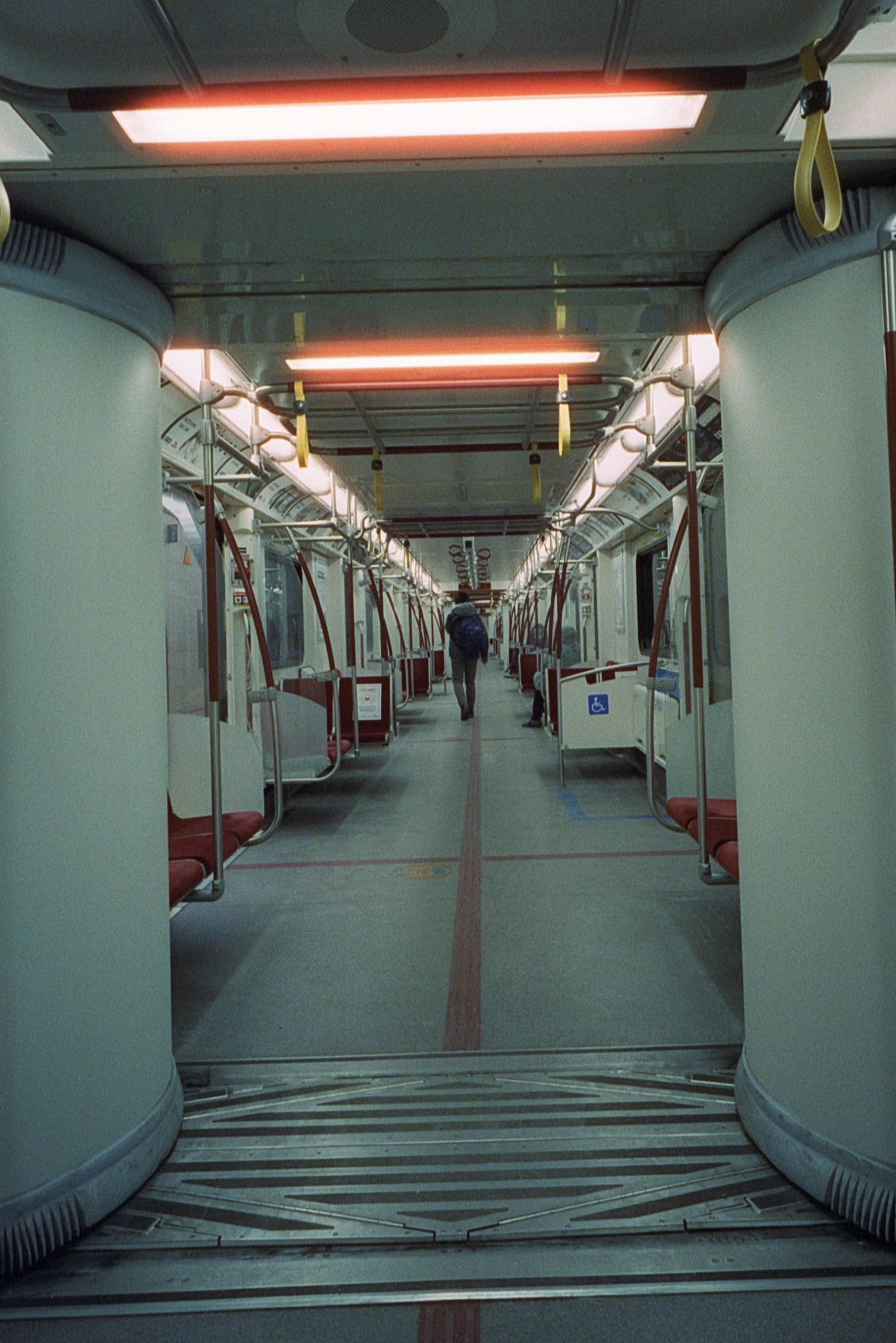 red and white train in train station