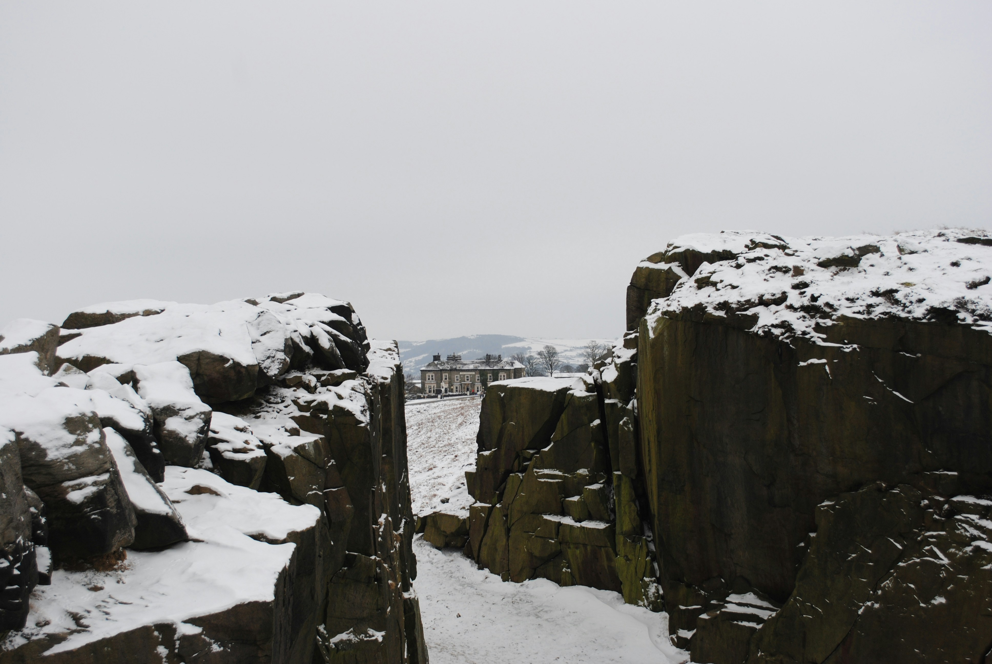 Snowbound Gorge: A Narrow Passage Between Granite Sentinels