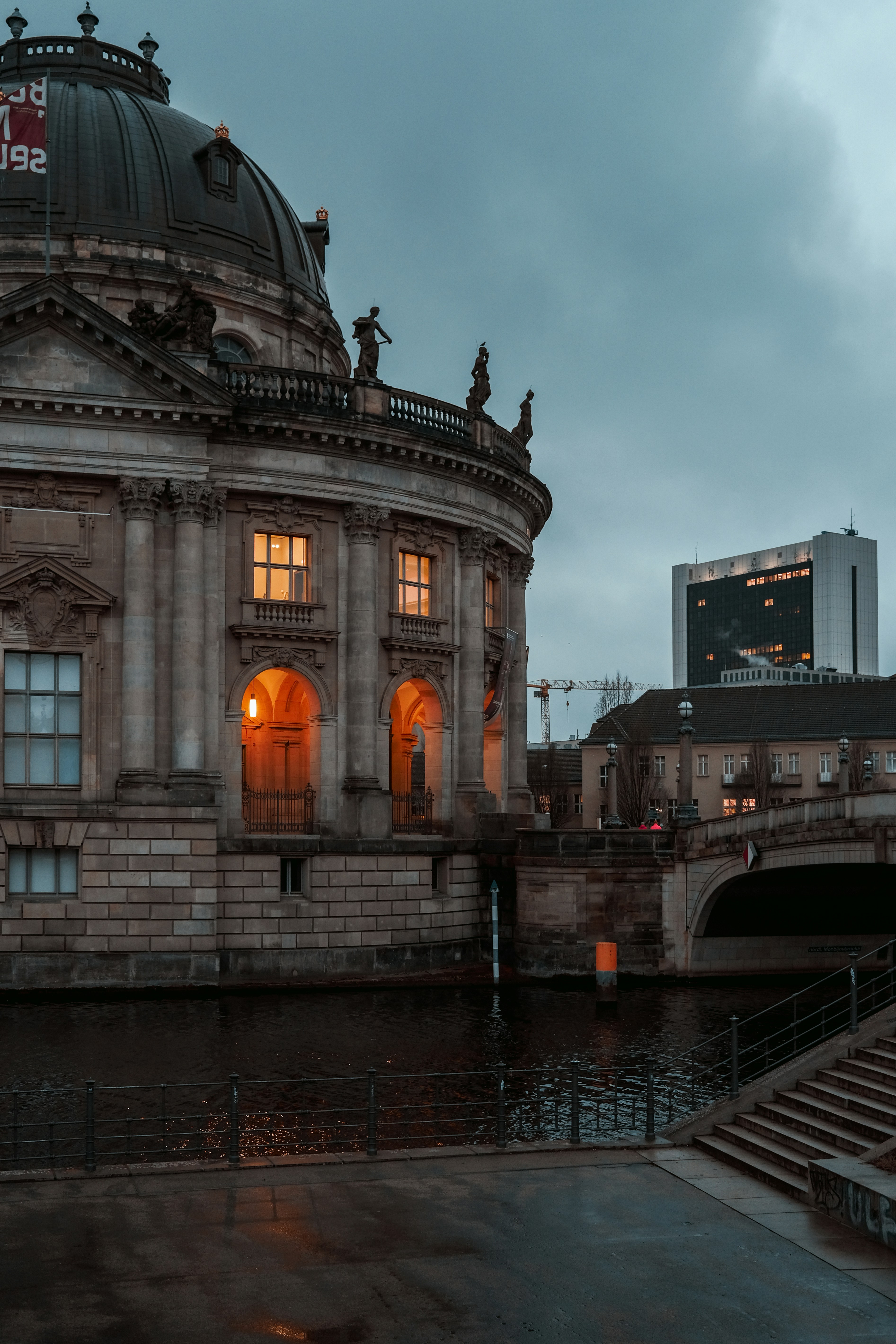 Gaslit Facade by the River: Classical Dome at Dusk