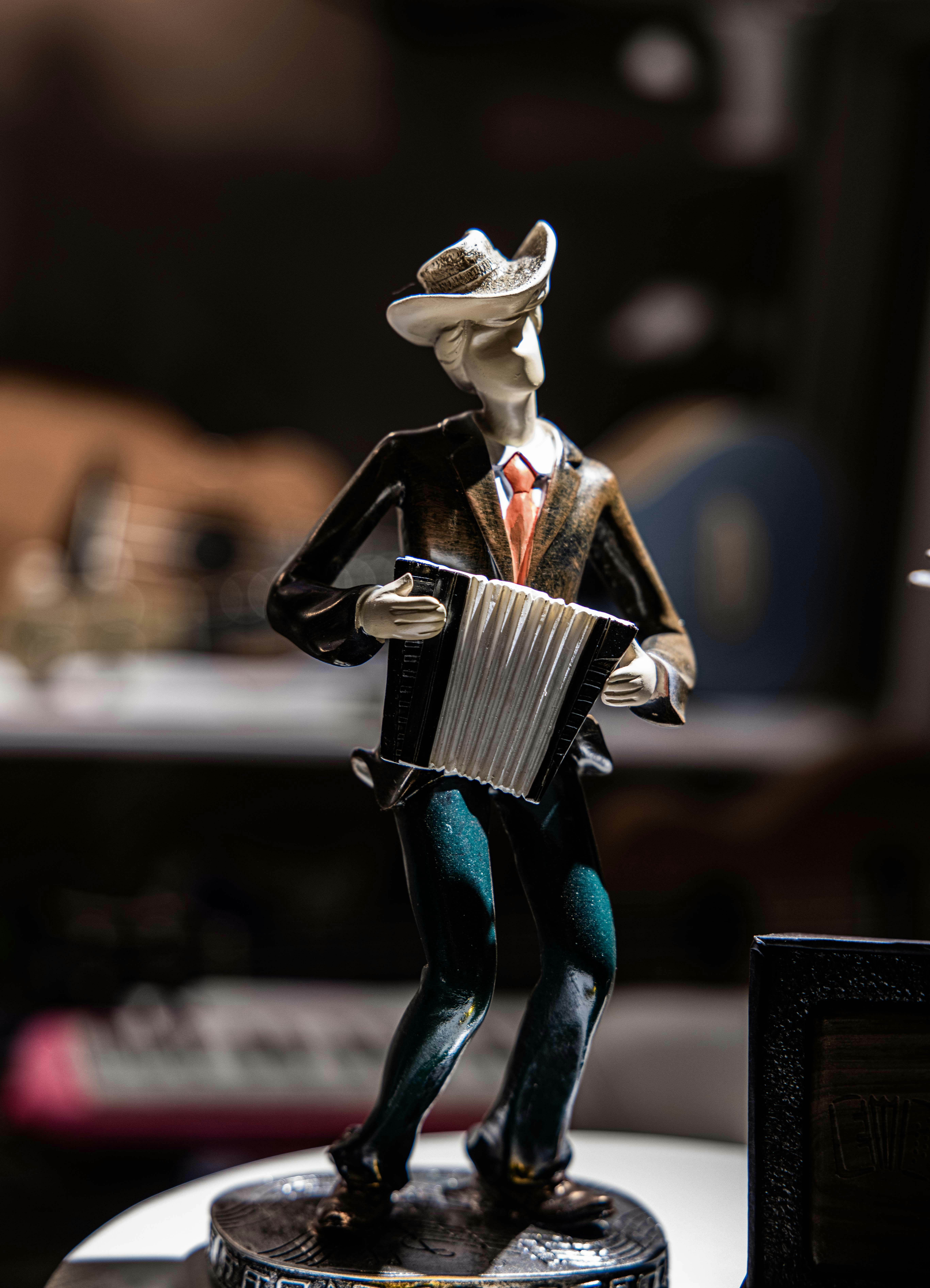 Whimsical Maestro: A Plaid-clad Figurine Plays the Accordion