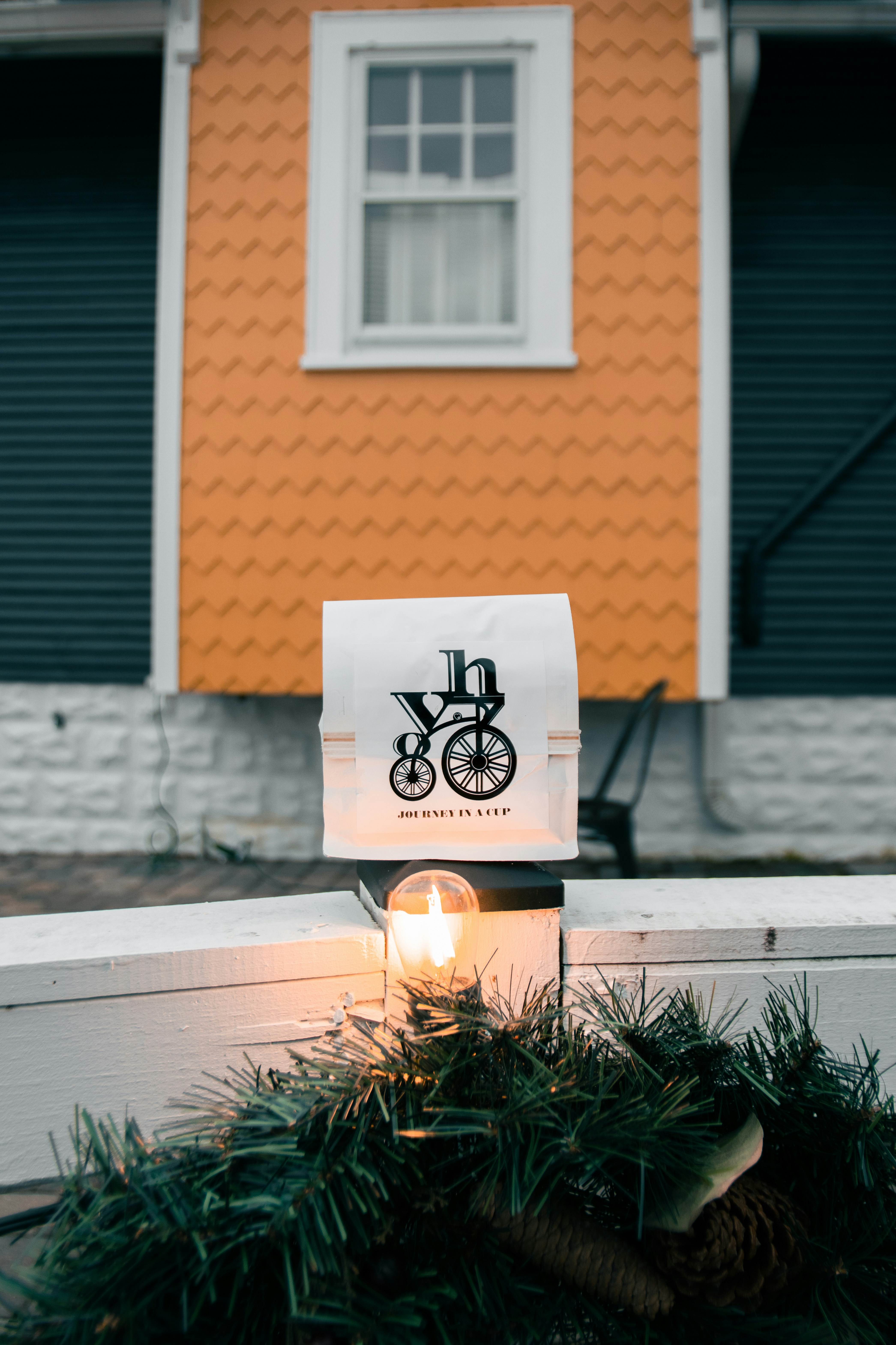Warm Front Door: A Paper Note and Light by the Gate