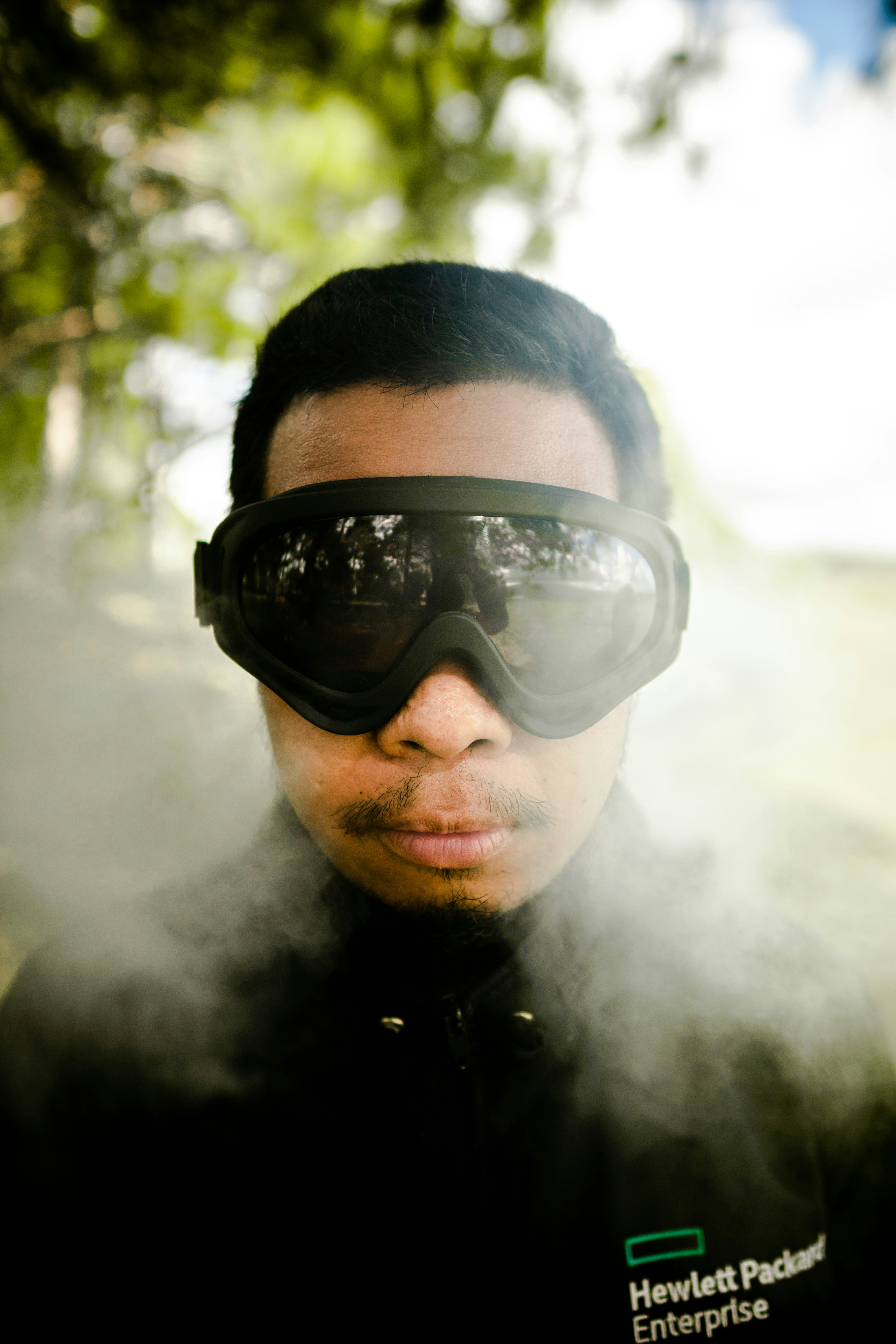 Misty Gaze Through Goggles: A Portrait Shrouded in Vapor