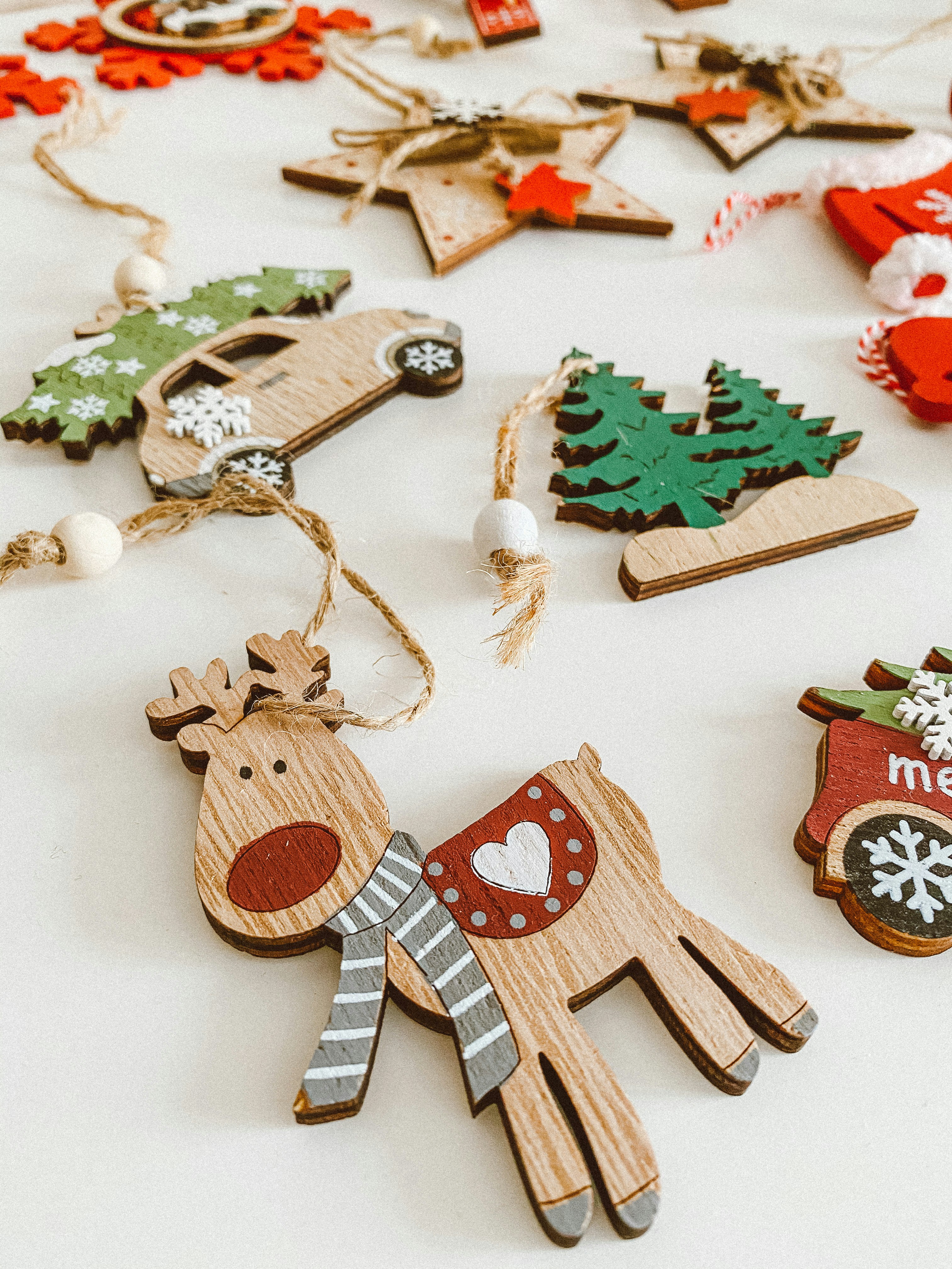 Wooden Reindeer Against a Holiday Craft Mosaic