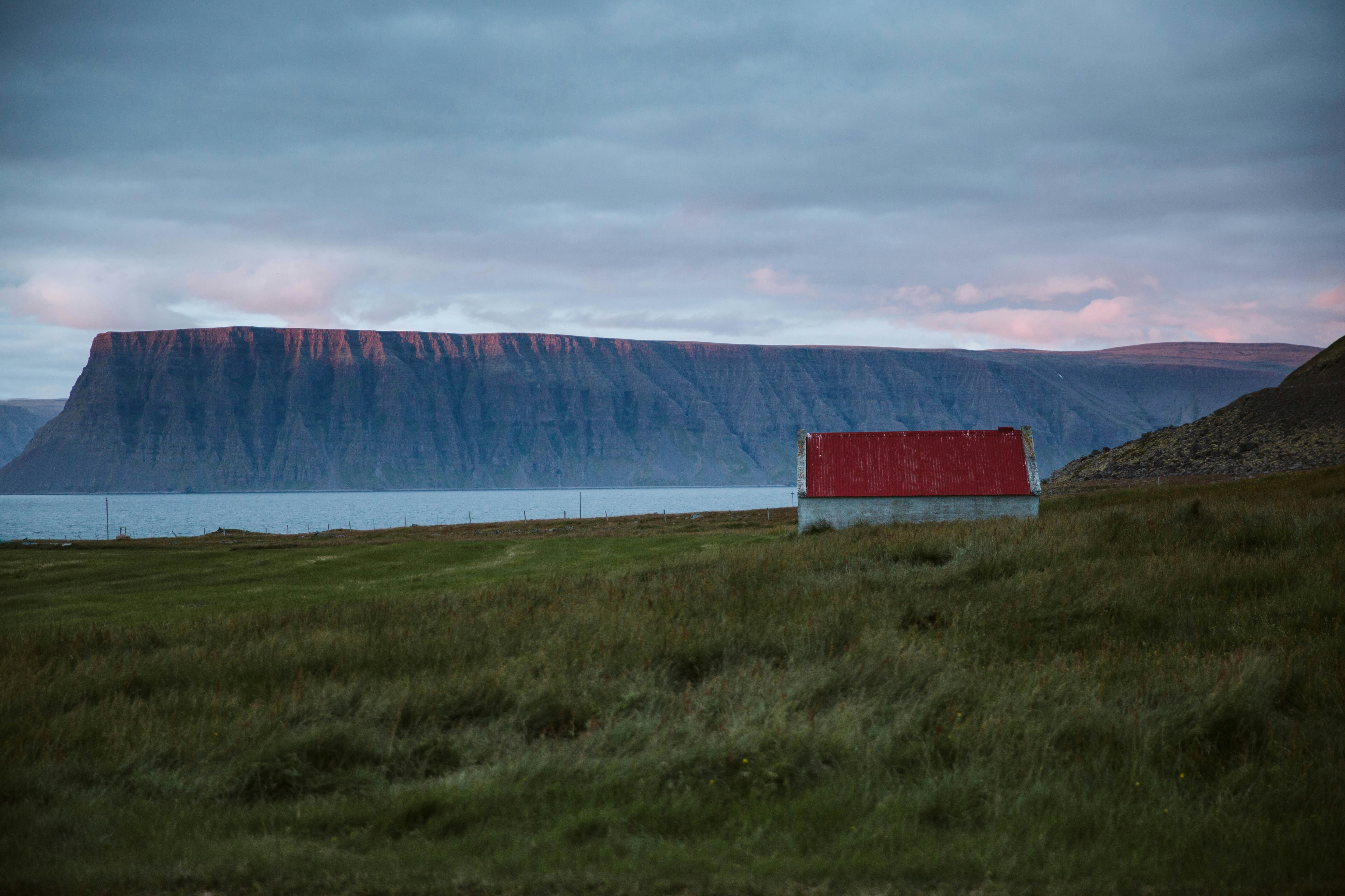 Red-roofed Cottage on a Wind-Swept Coastal Plain