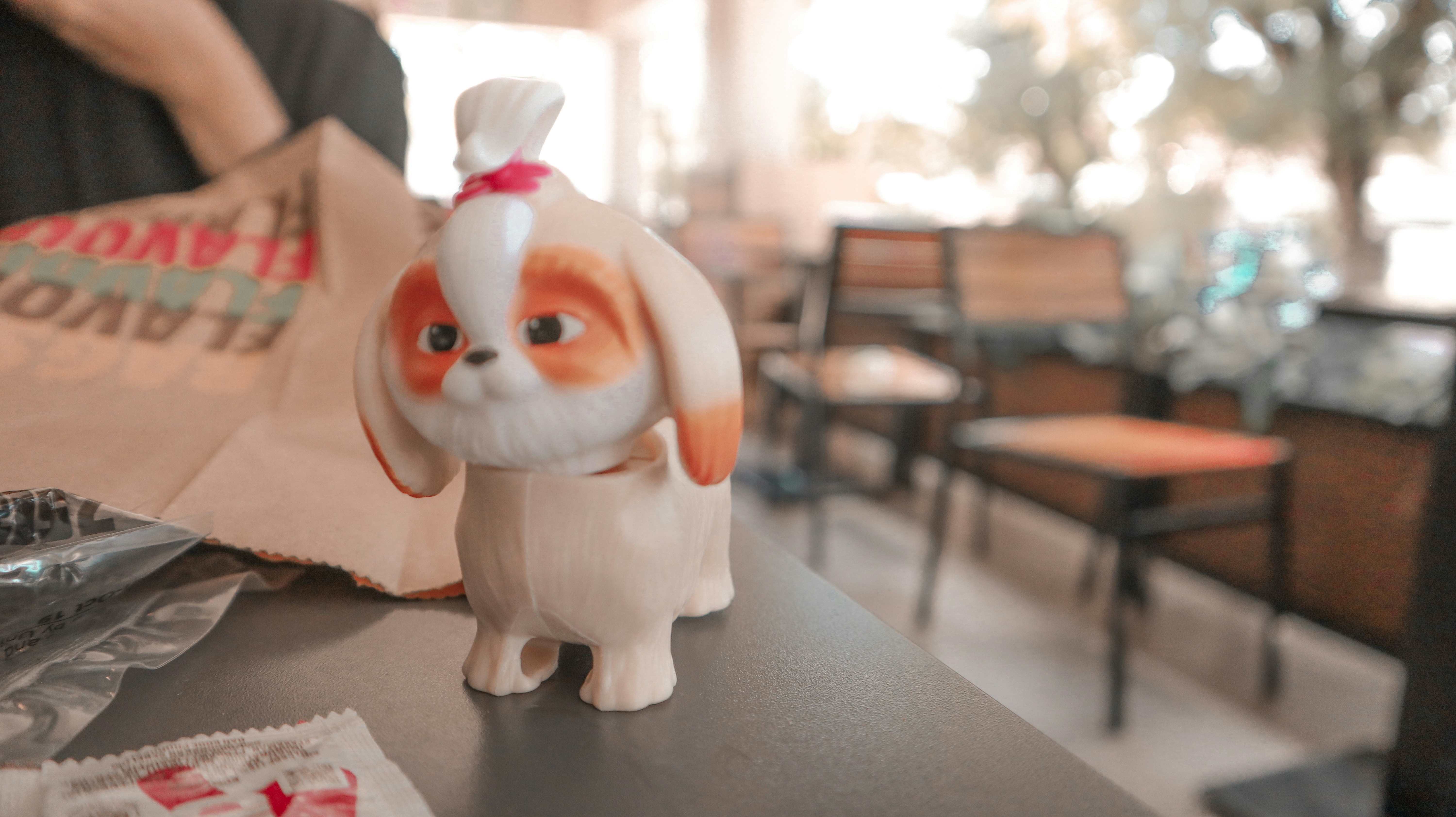 Tiny Bunny, Big Moment: A Plush Planting a Smile on a Quiet Café Table