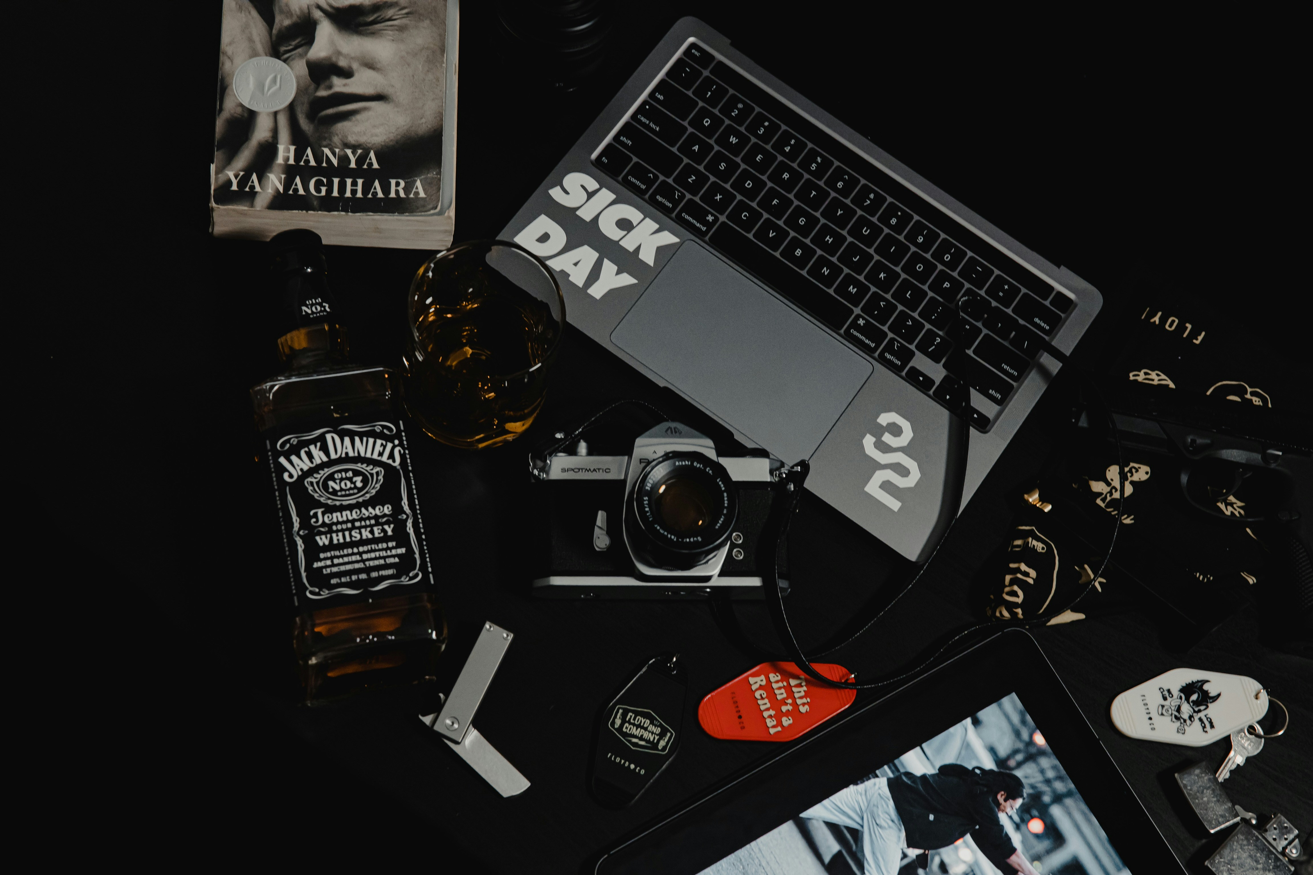 Black and silver laptop computer beside black and silver dslr camera ...