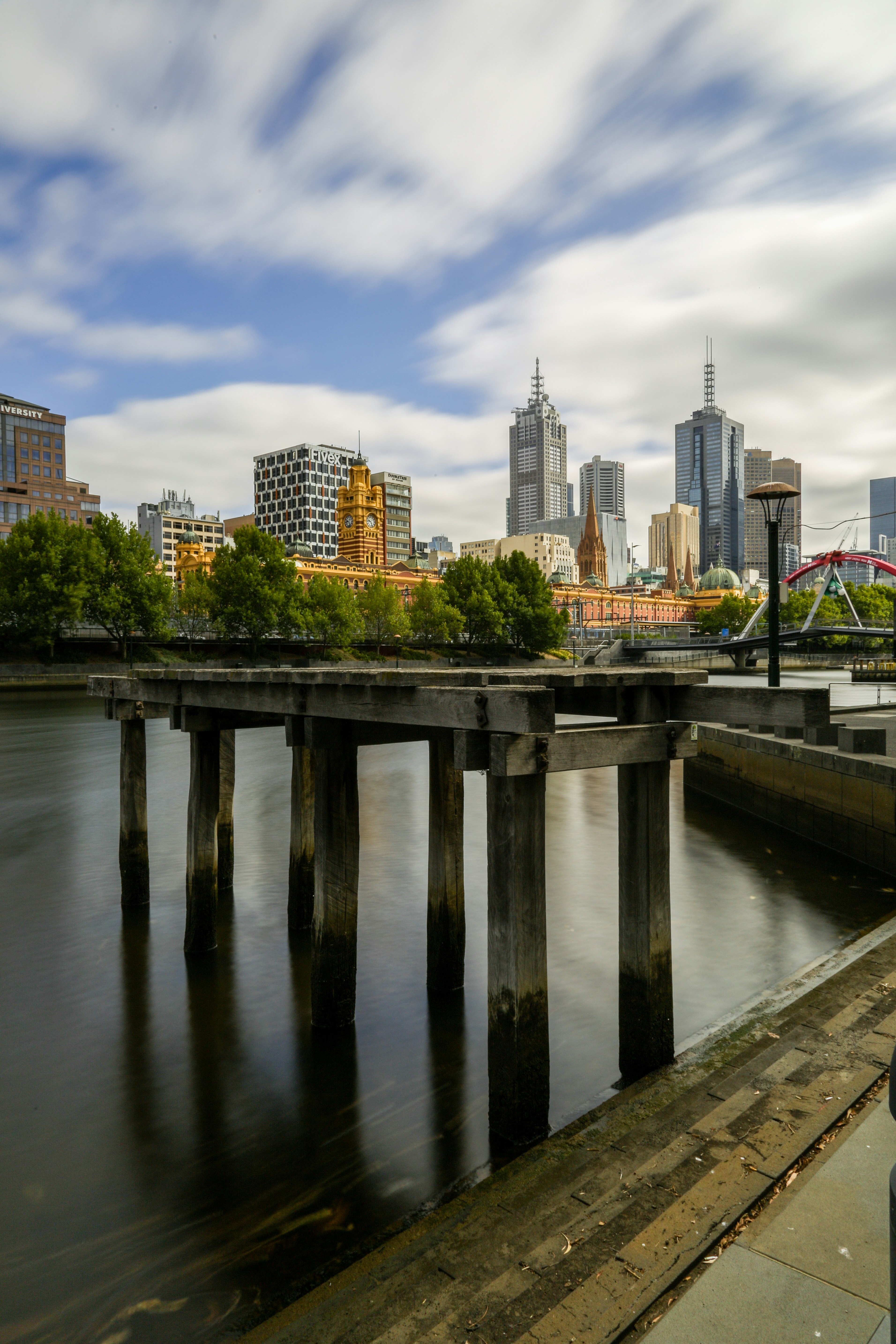 gray concrete bridge over river