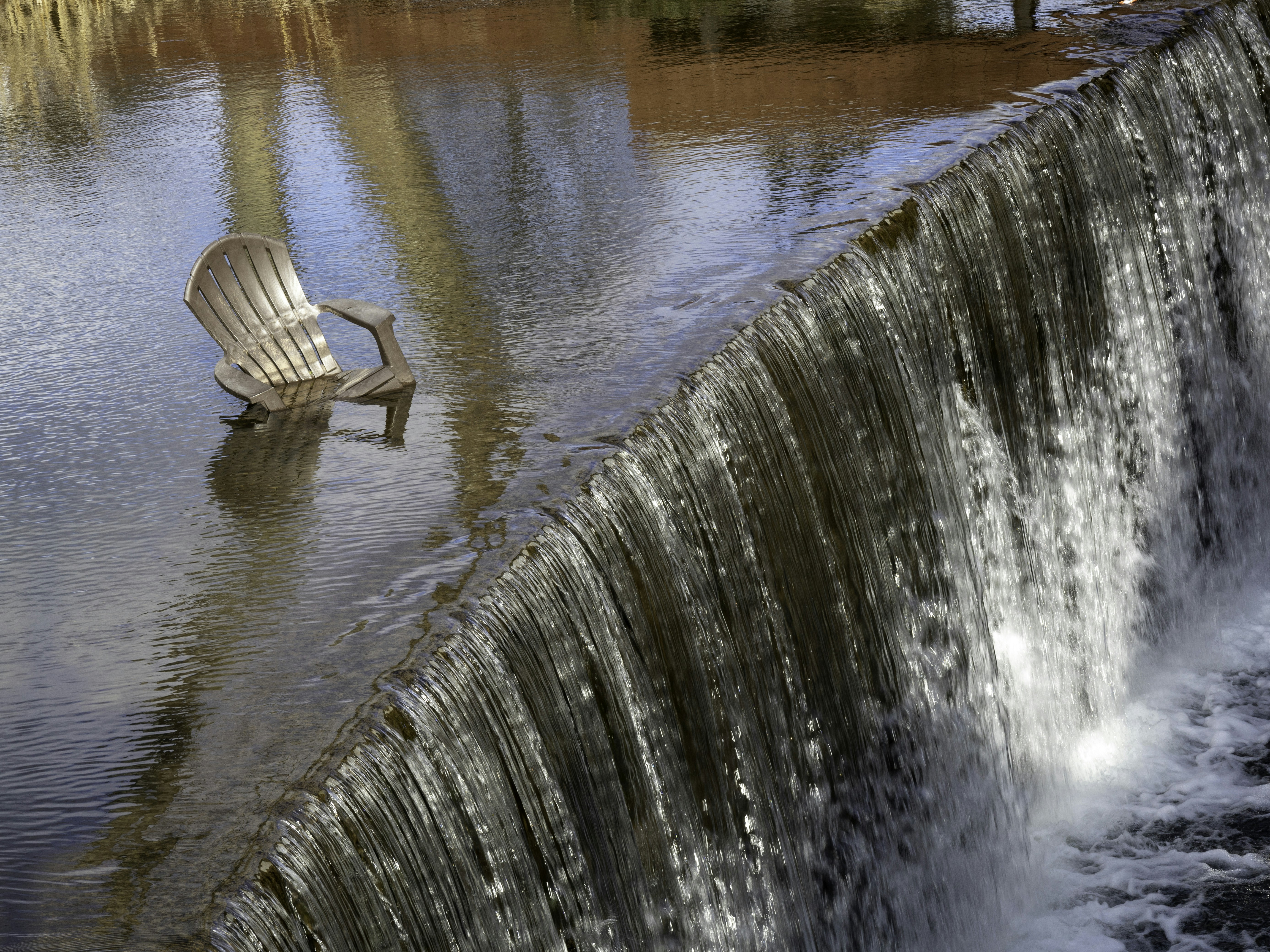 Solitary Adirondack Adrift Over the Falls