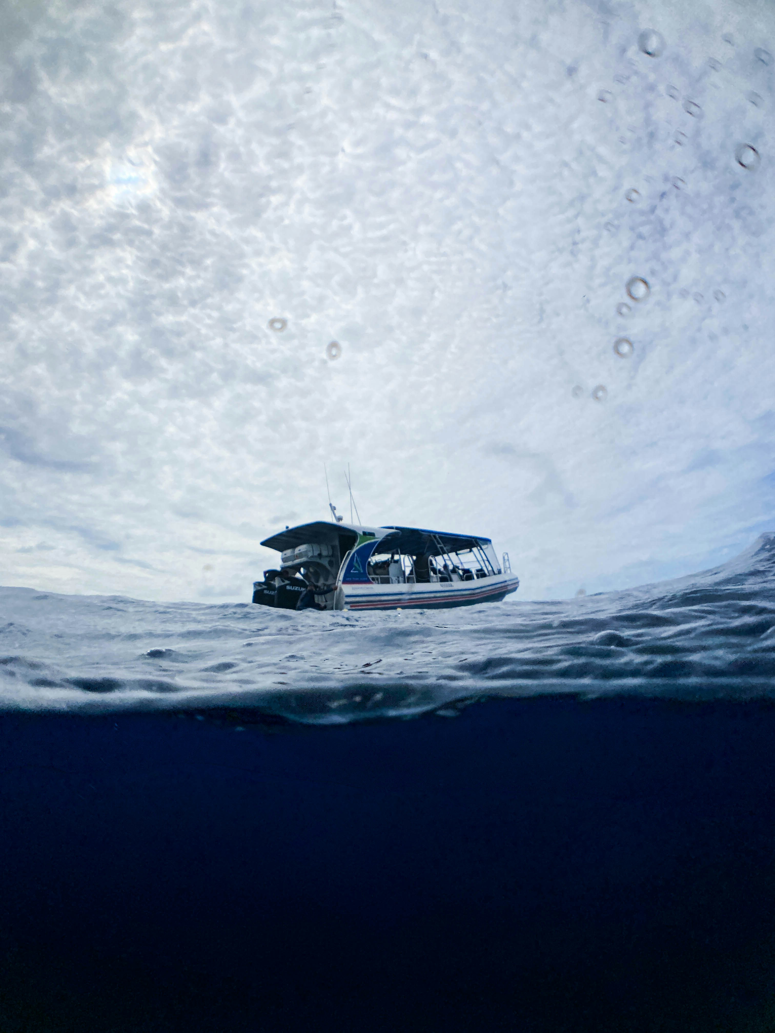 Across the Divide: A Boat Hovering Between Sky and Sea