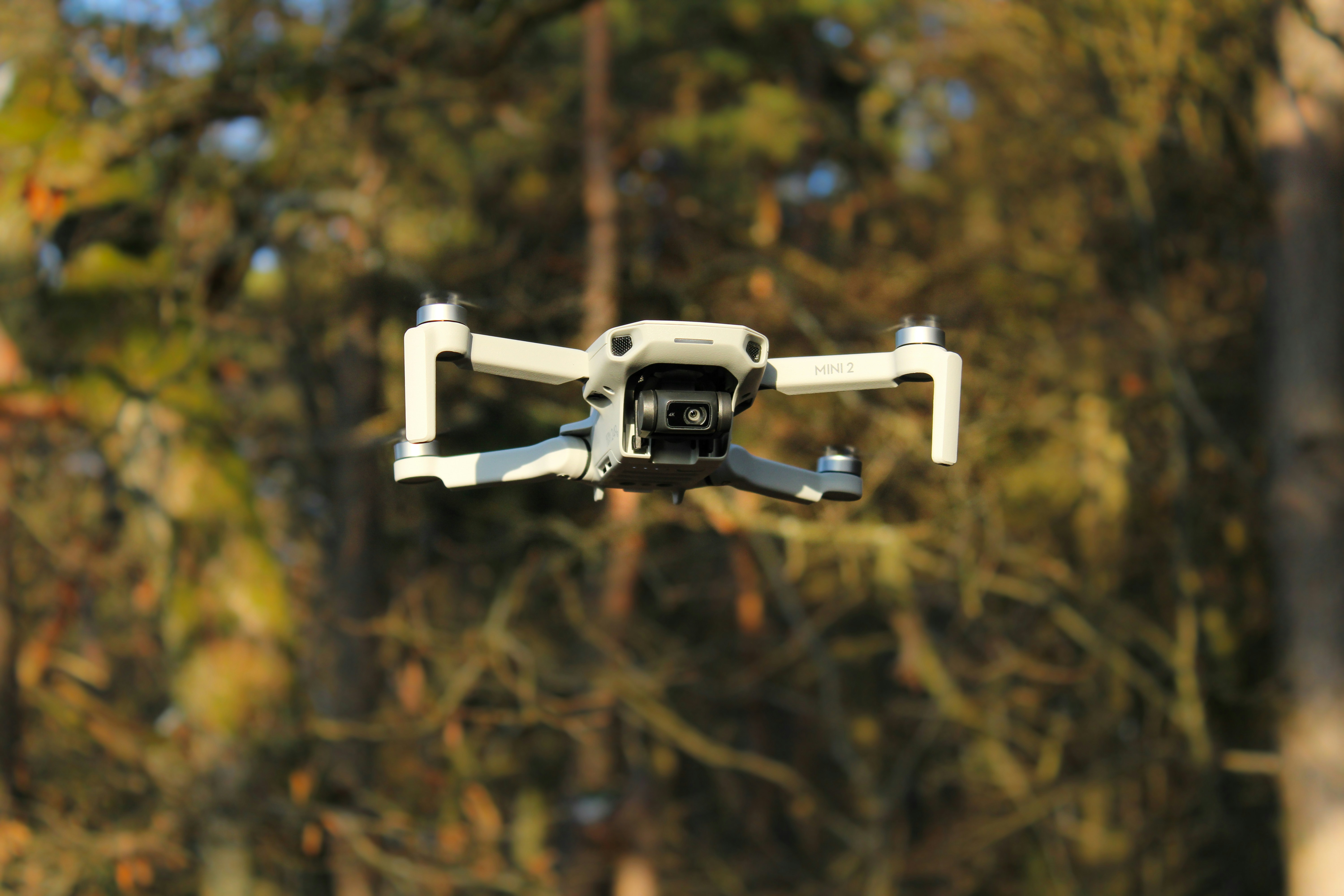 White and black drone in tilt shift lens photo – Free Flying drones Image on Unsplash
